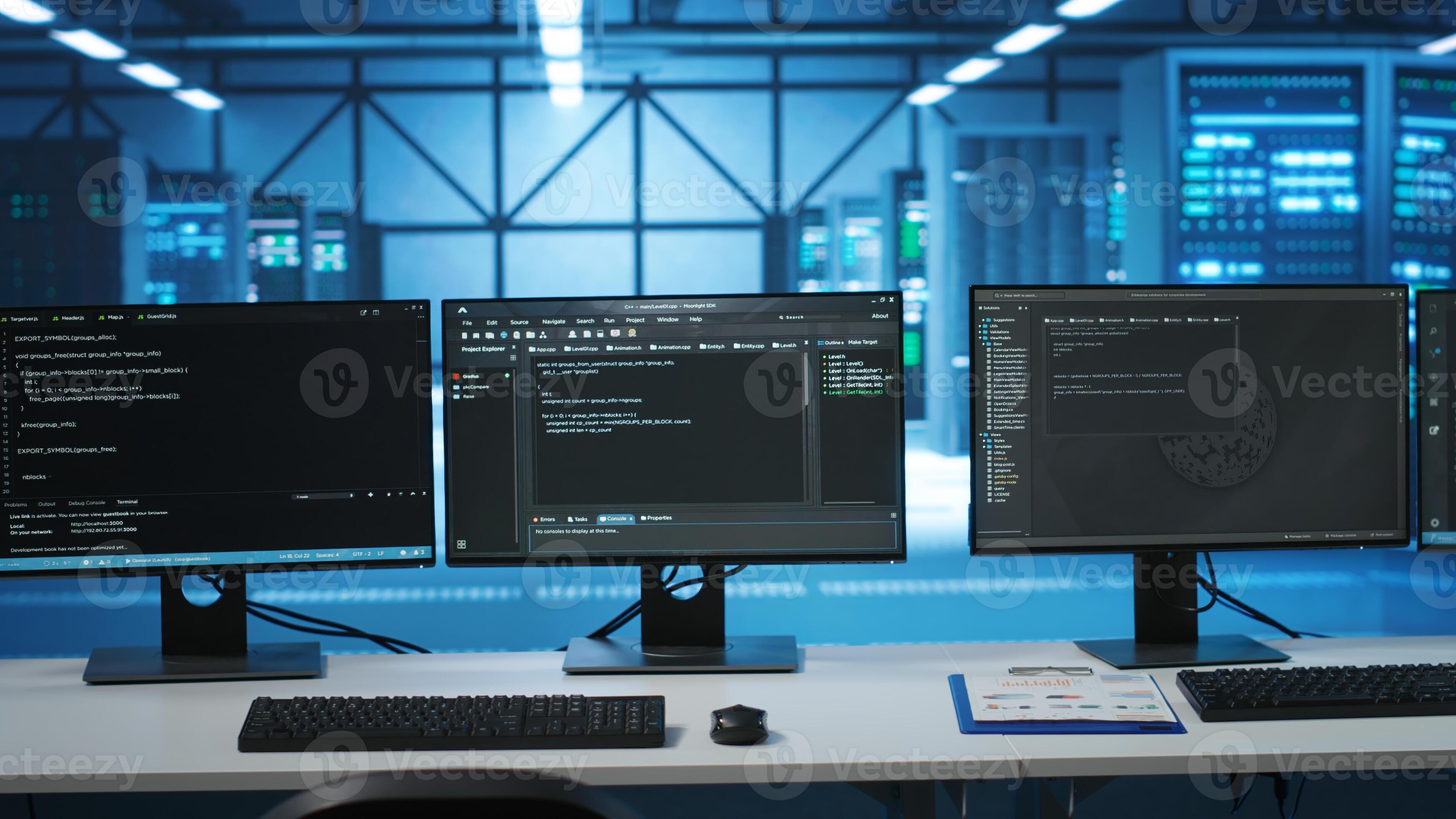 Lines of code running on computer screens in data center, used for troubleshooting rackmounts in ...