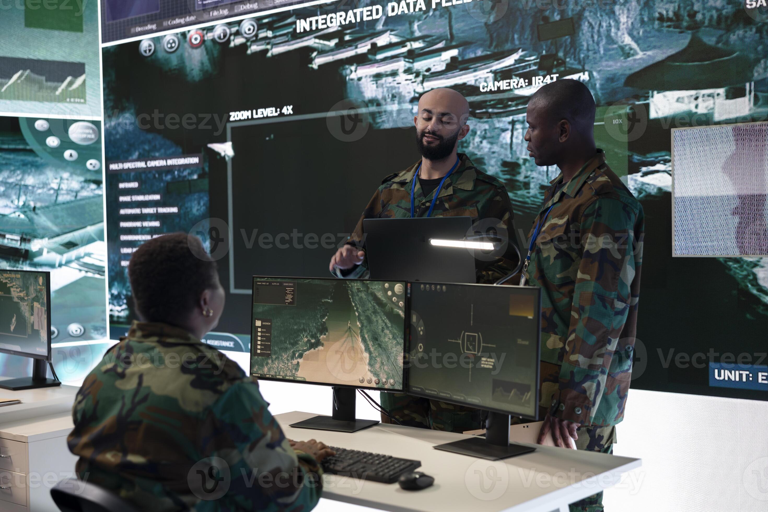 Army conscripts discussing with the IT technical engineer to ensure ...