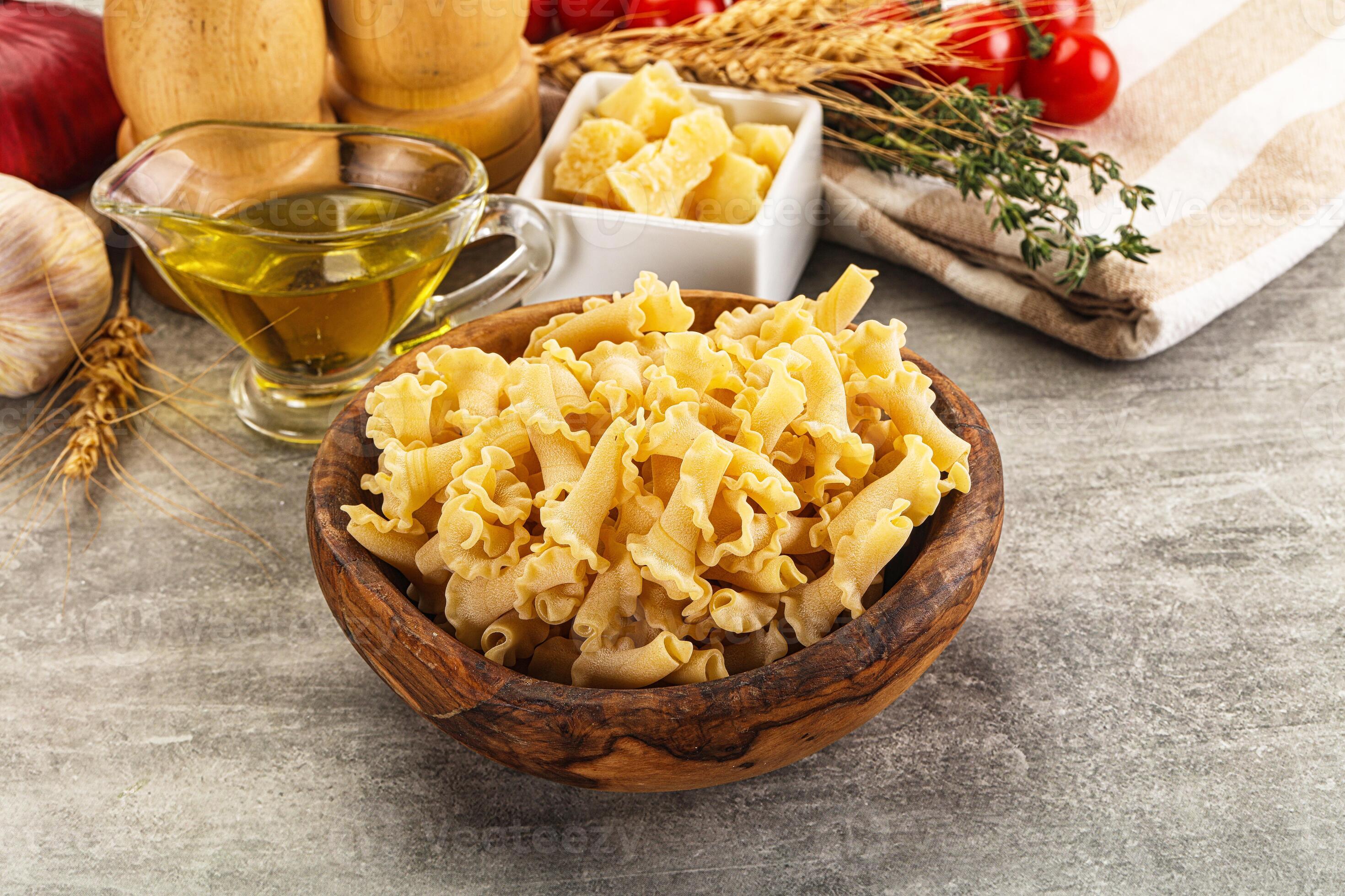 Raw dry Italian pasta - campanelle 46510138 Stock Photo at Vecteezy