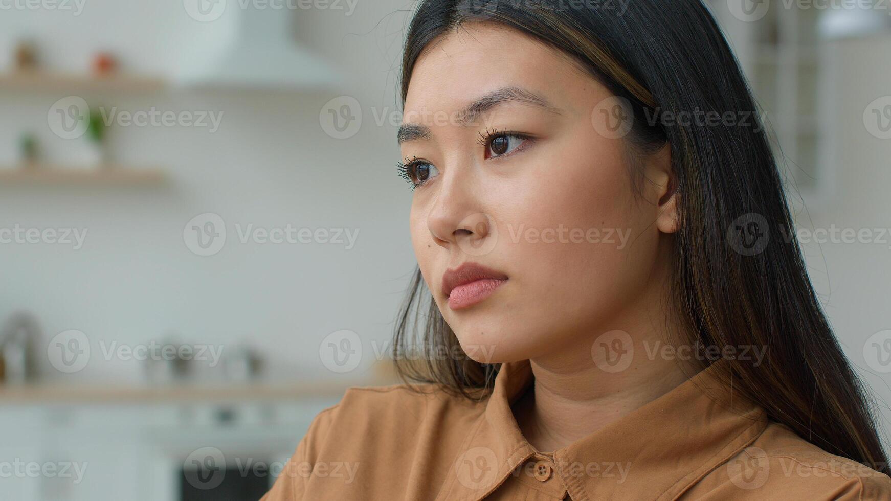 Close up view lonely Asian woman thoughtful pensive korean girl looking in distance deep ...