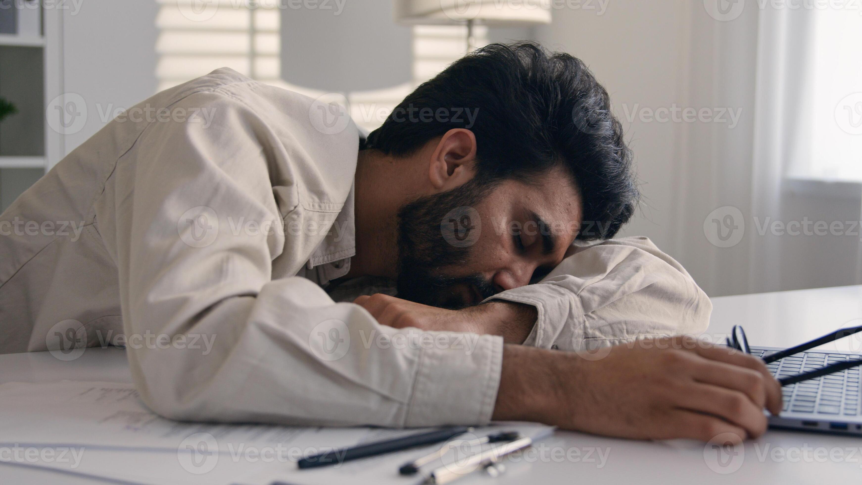 Lazy weary sleepy male manager tired exhausted Arabian Indian ...
