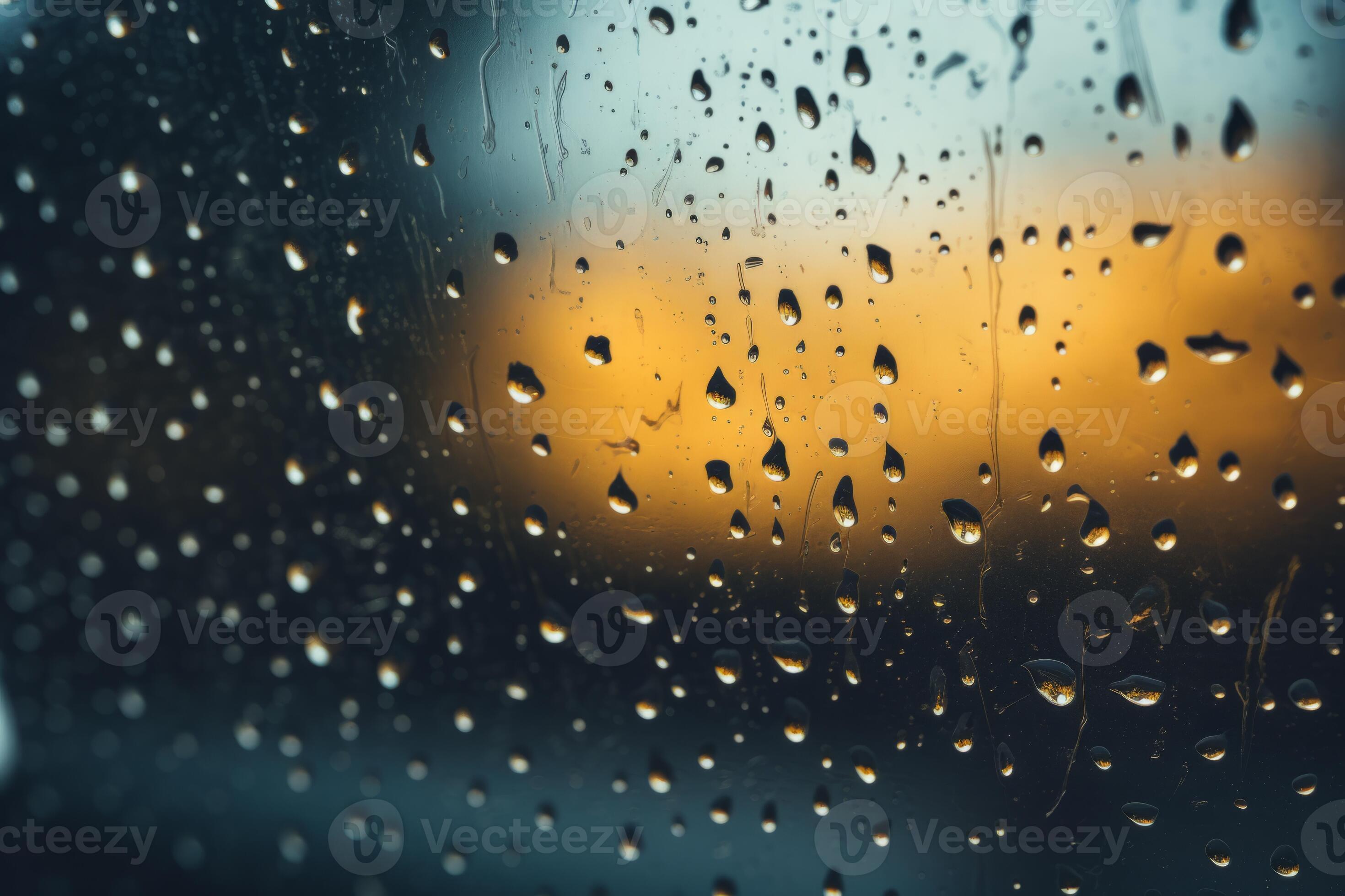Shiny raindrops splashes falling cascading down wet glossy foggy glass window car outdoor during ...