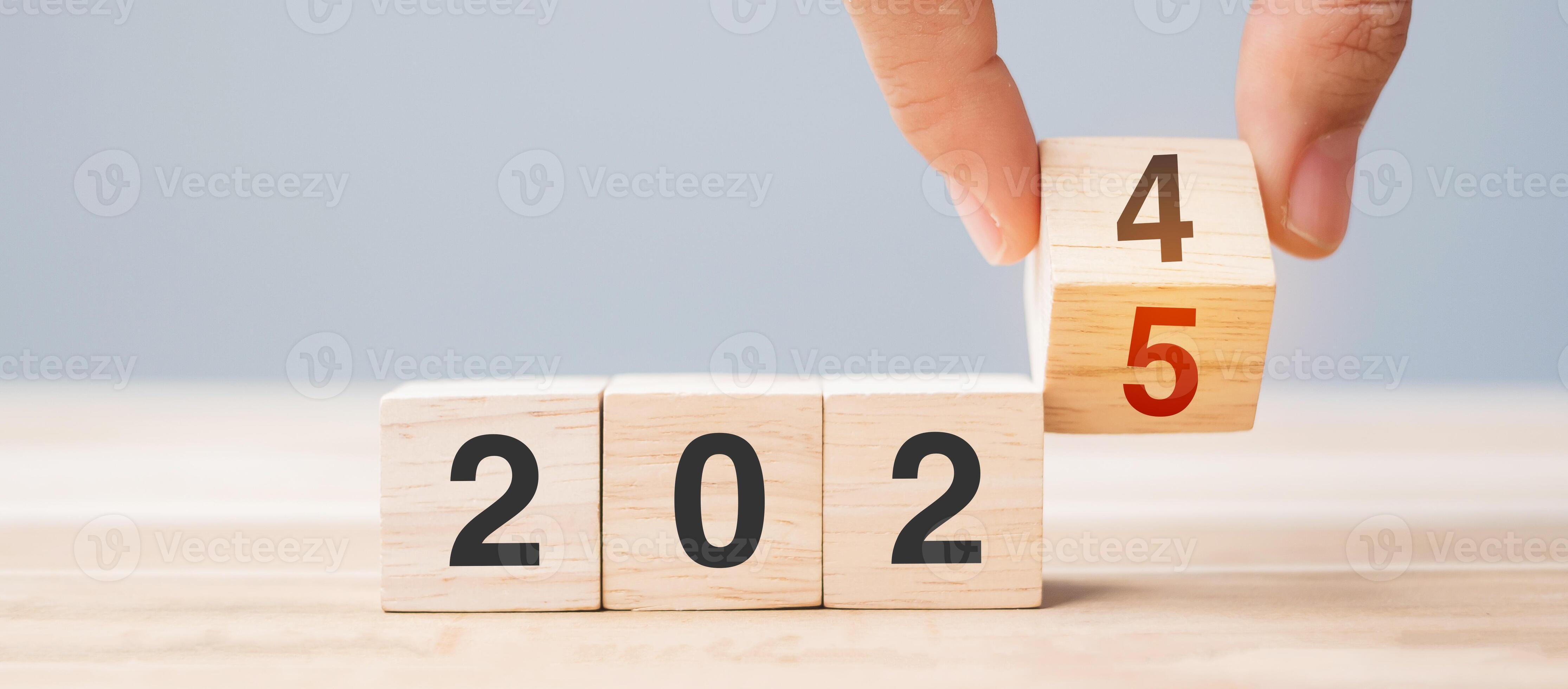 hand flip cube block 2024 to 2025 text on table. Resolution, review ... hand flip cube block 2024 to 2025 text on table. Resolution, review ...