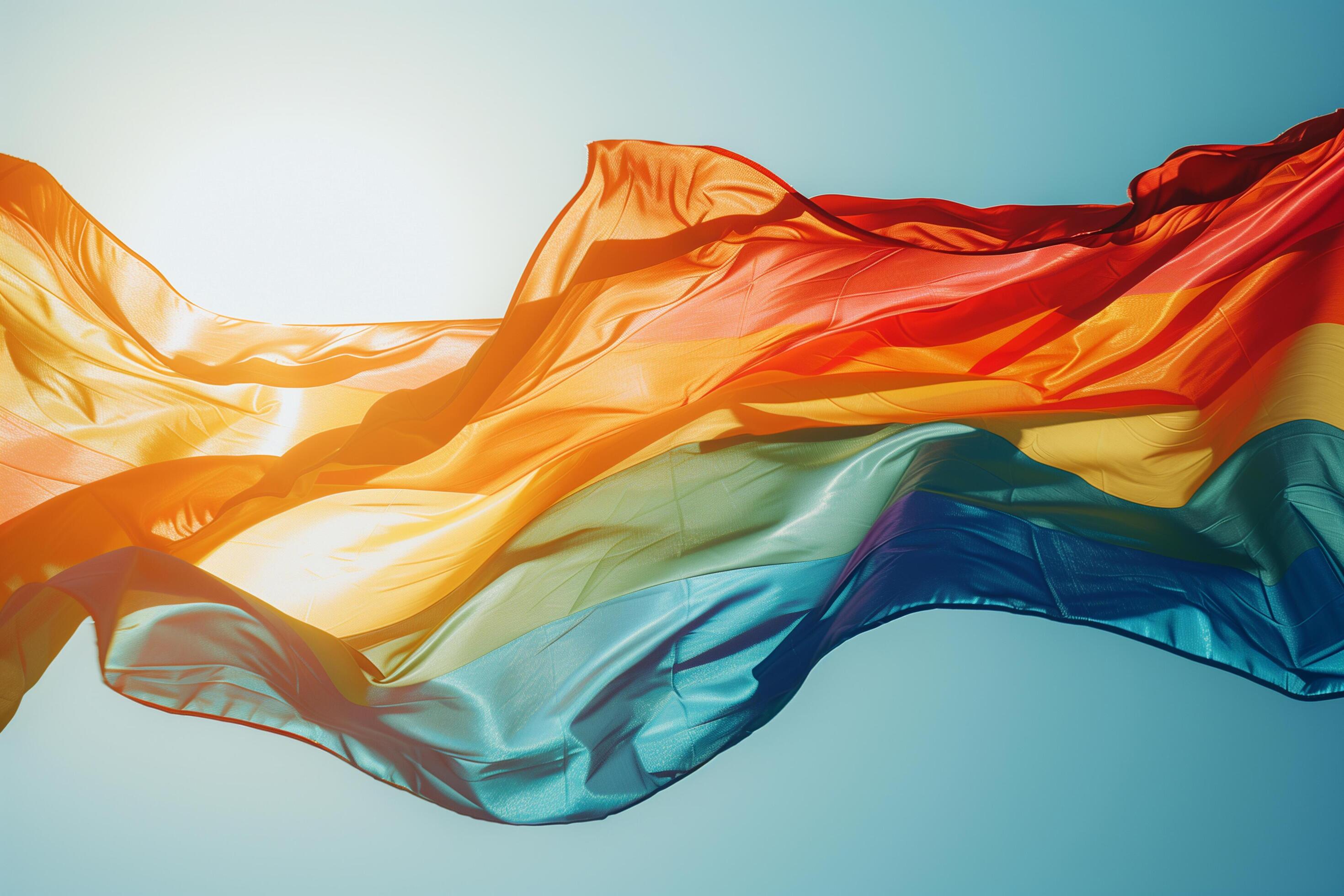A Vibrant And Flowing Pride Flag Waving Majestically In The Breeze