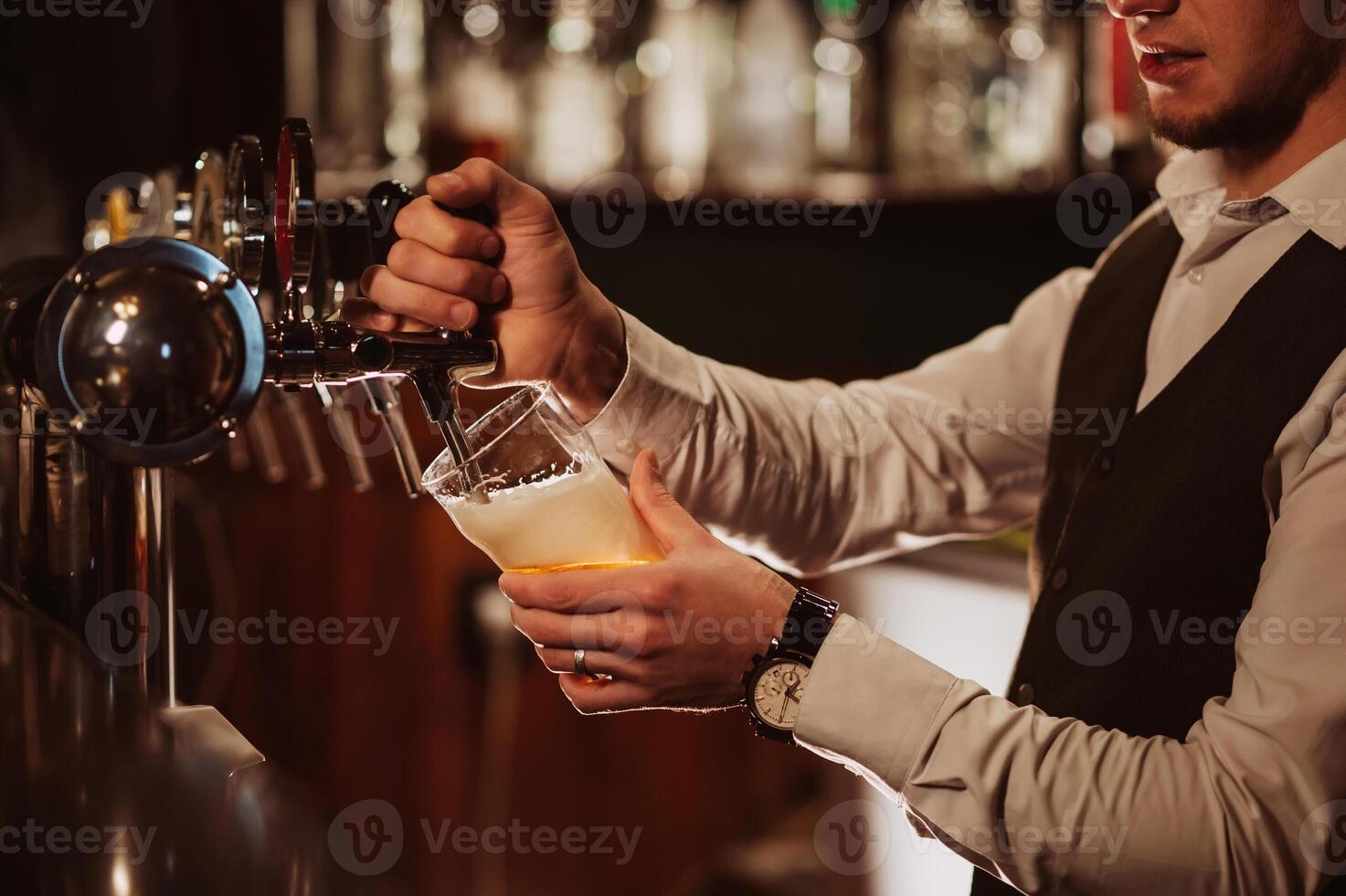 hands of bartender pour into glass draught light foamy beer from tap 46617057 Stock Photo at ...