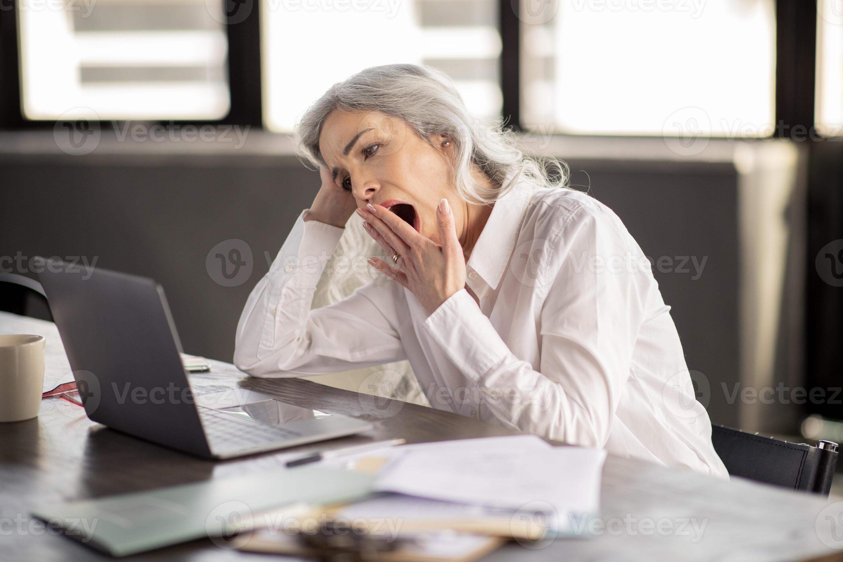 Fatigue Issue. Bored Middle Aged Businesswoman Yawning Looking At ...
