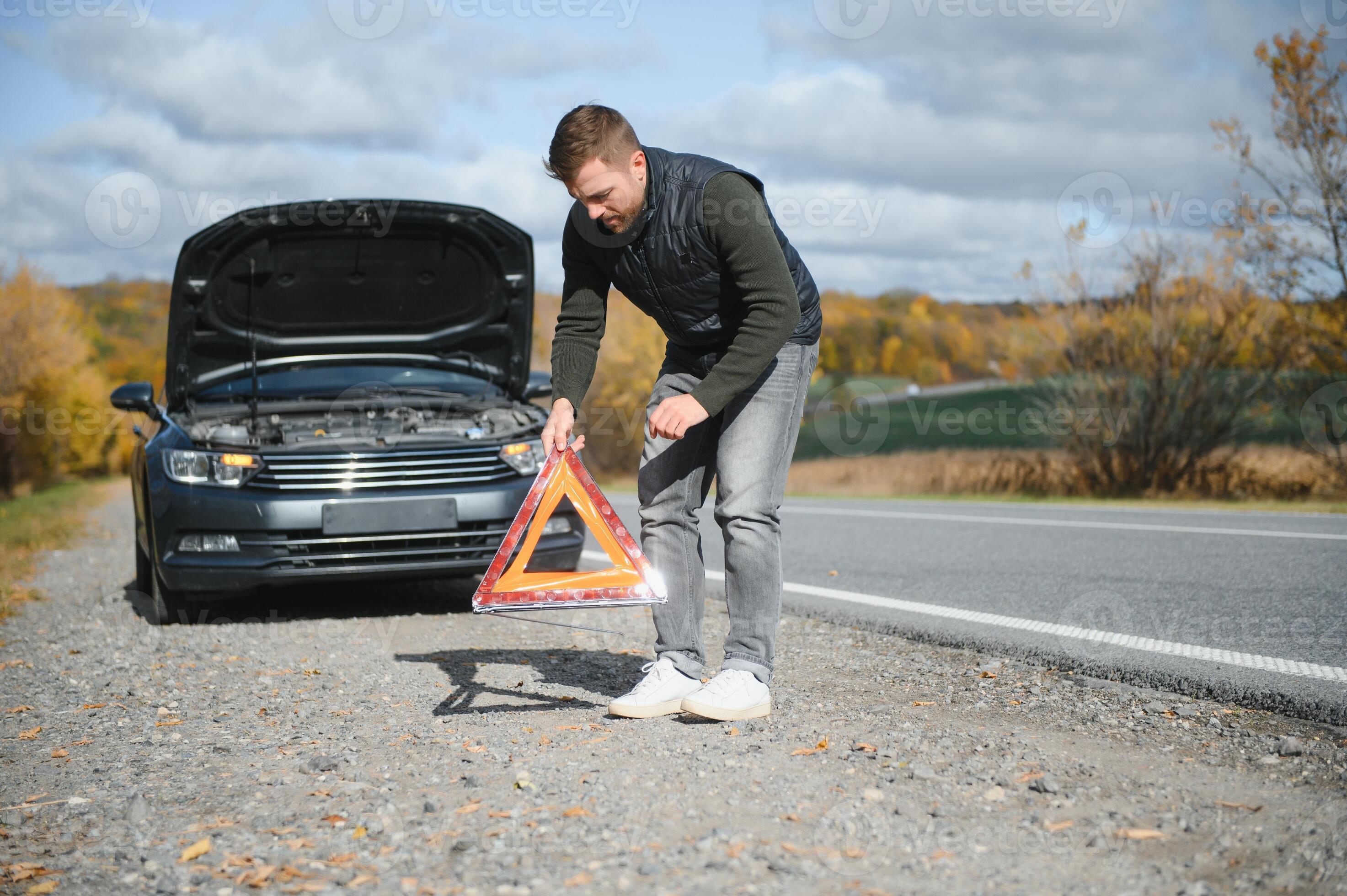 A young man with a black car that broke down on the road,copy space. 46758113 Stock Photo at ...