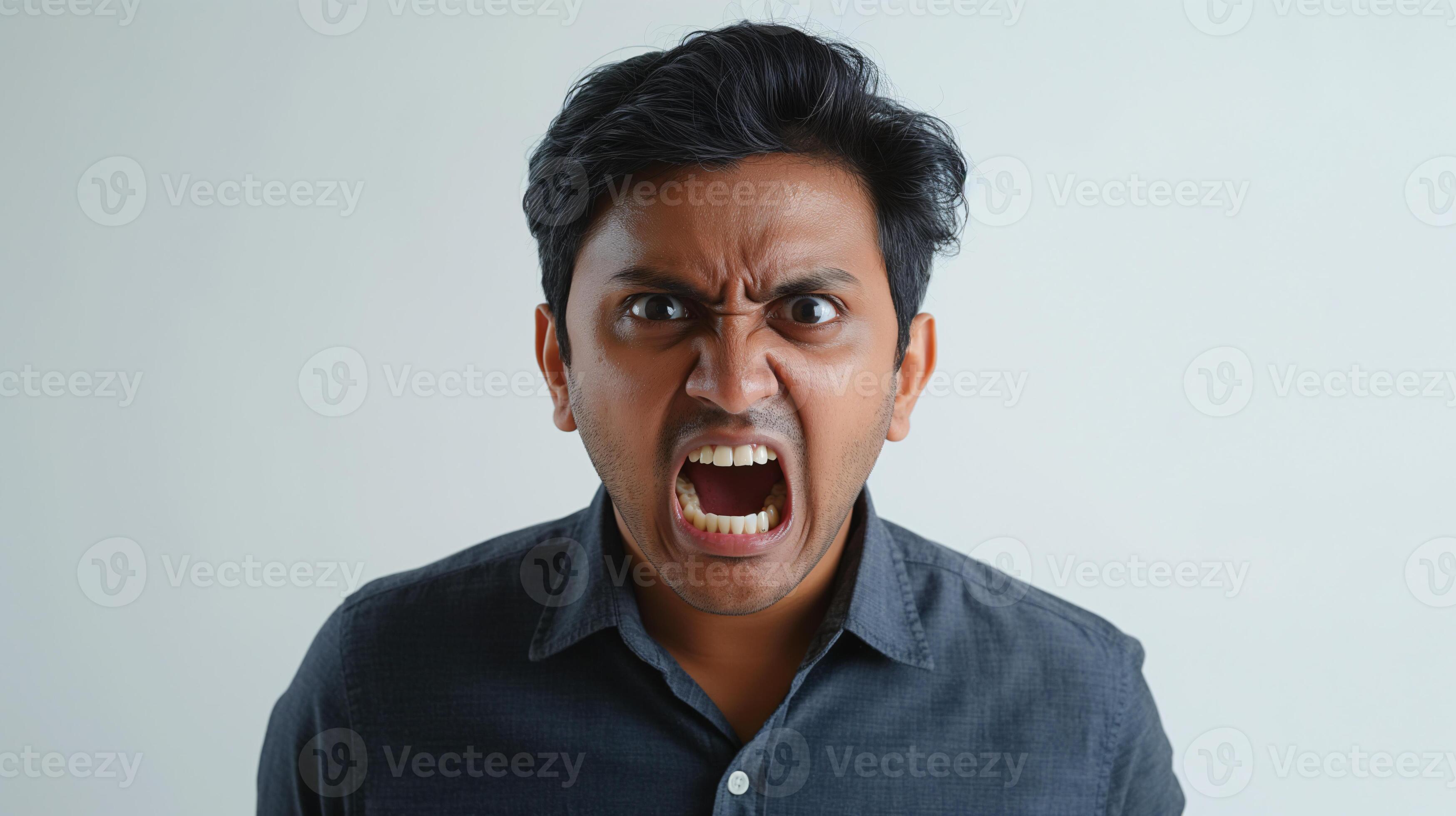 Angry South Asian Man in Dark Shirt Yelling with Intense Expression ...