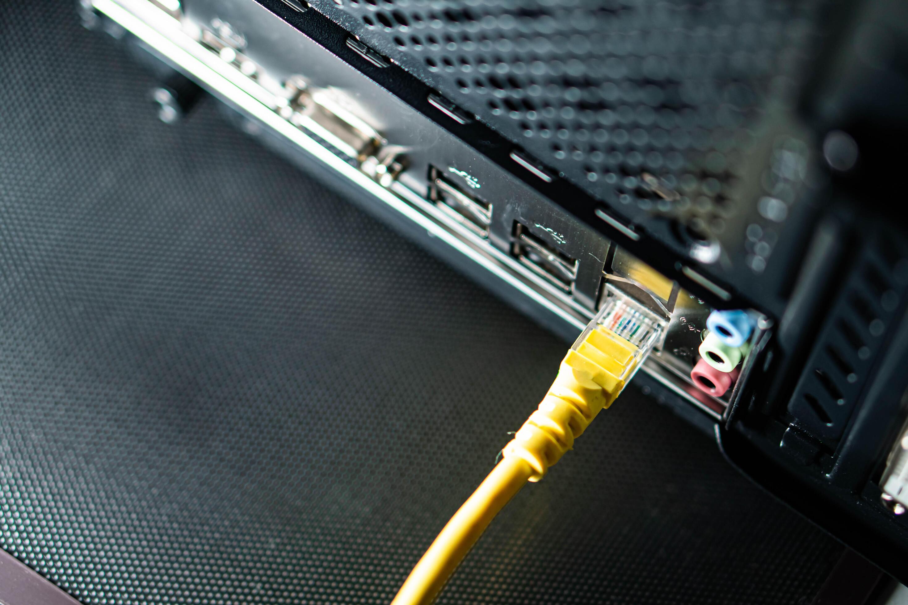 Yellow Ethernet cable connected to computer 46780521 Stock Photo at ...