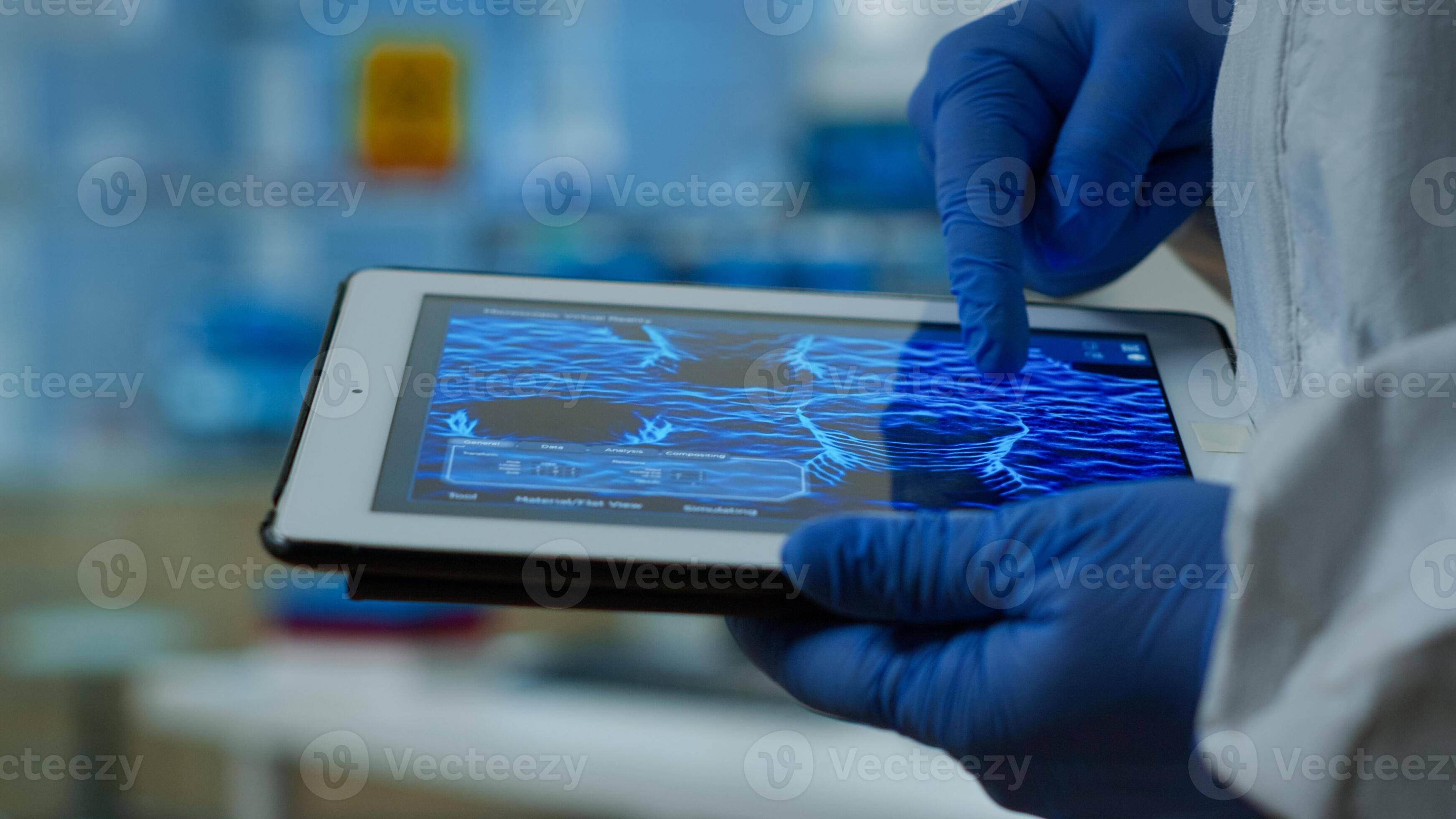 Close Up Of Chemist Doctor Working On Tablet With Dna Scan Image