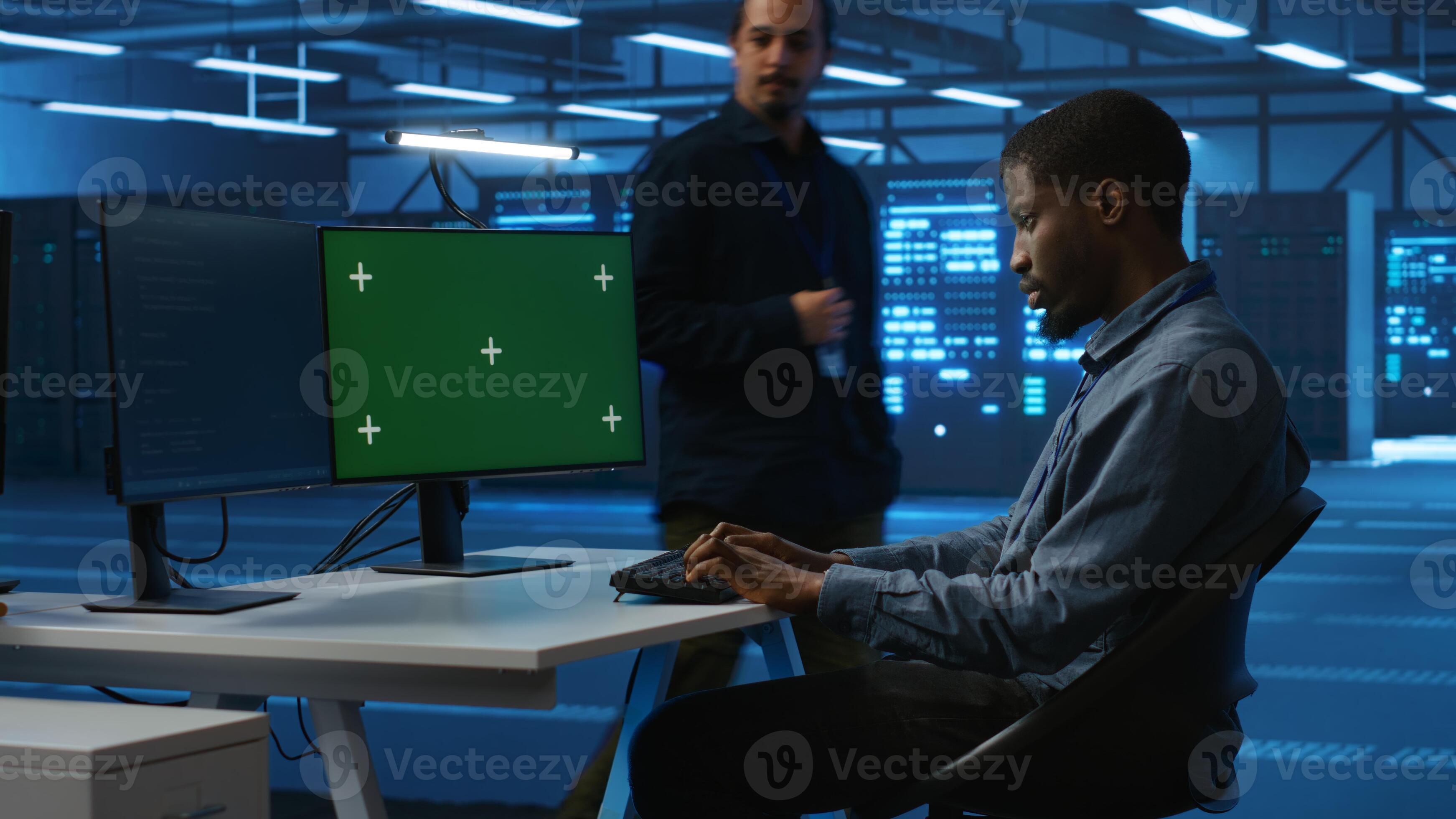Technician Upgrading Equipment In Data Center Using Isolated Screen Display Professional At Pc