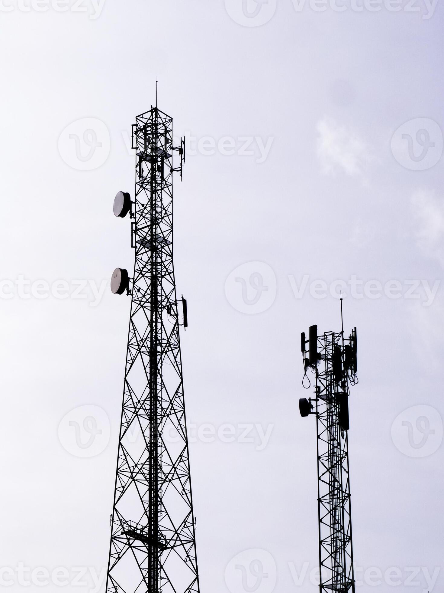 Tall Communication Towers Against a Clear Sky for Modern Telecommunication and Broadcasting ...