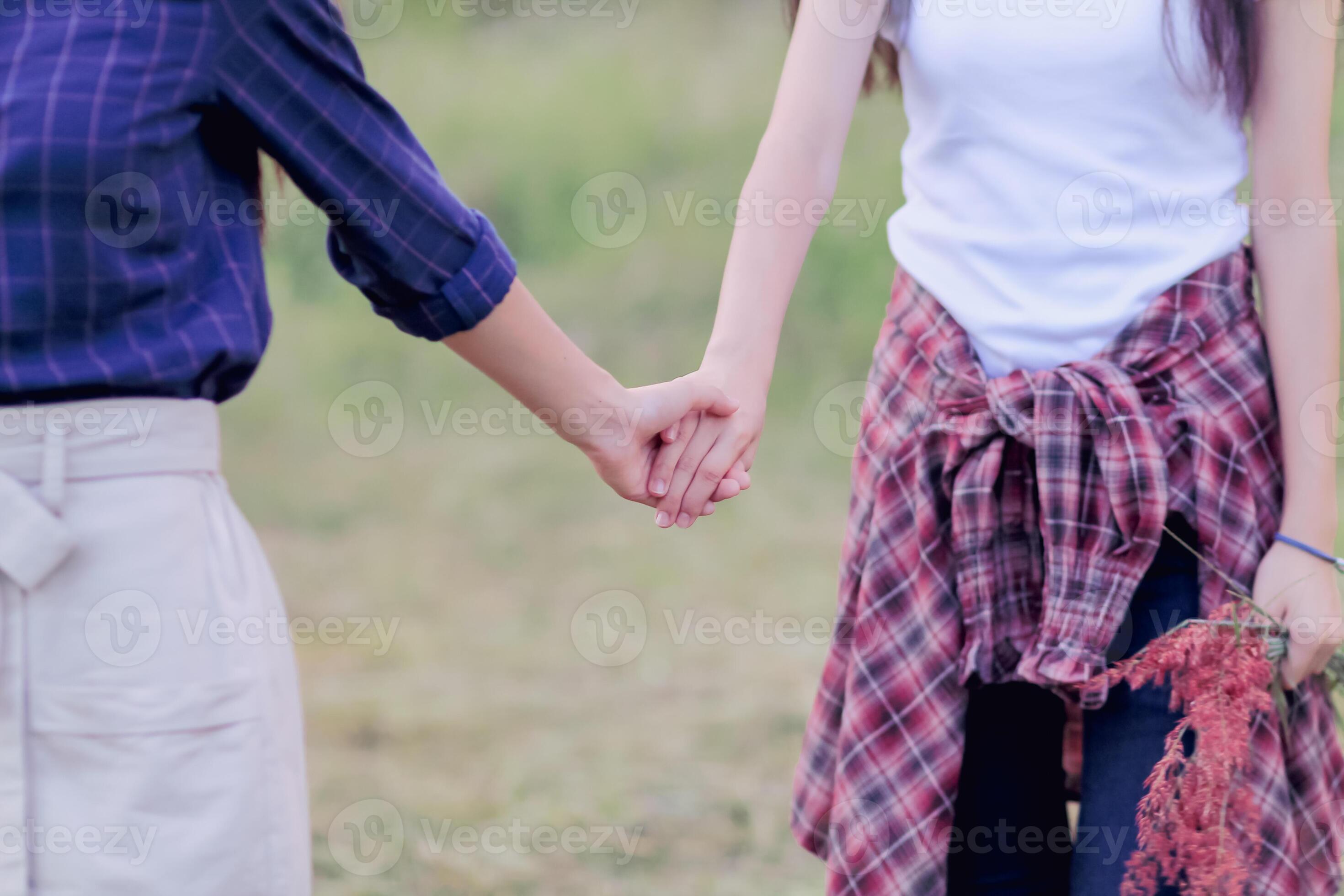 lgbtq couples hold hands to express their love and show couples confidence in their love for ...