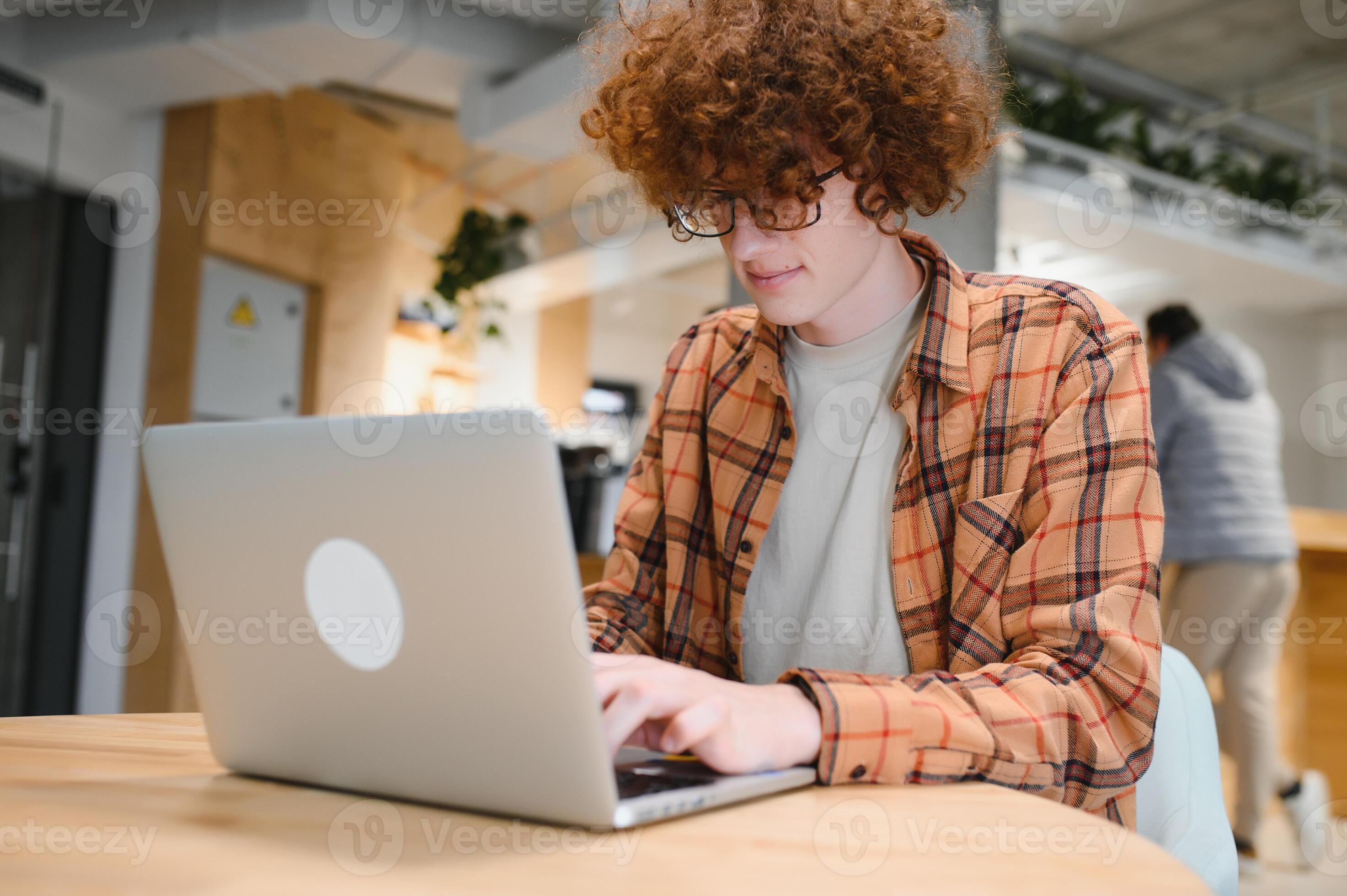 male programmer wear spectacles for eyes protection while working on ...