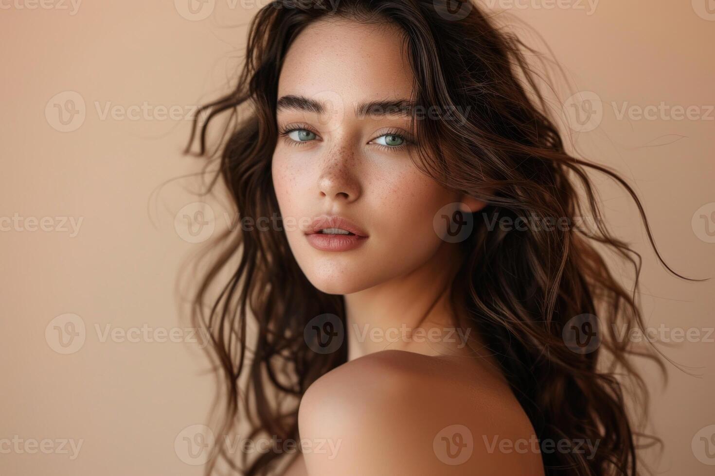 Beautiful caucasian woman with long brown hair posing on beige ...