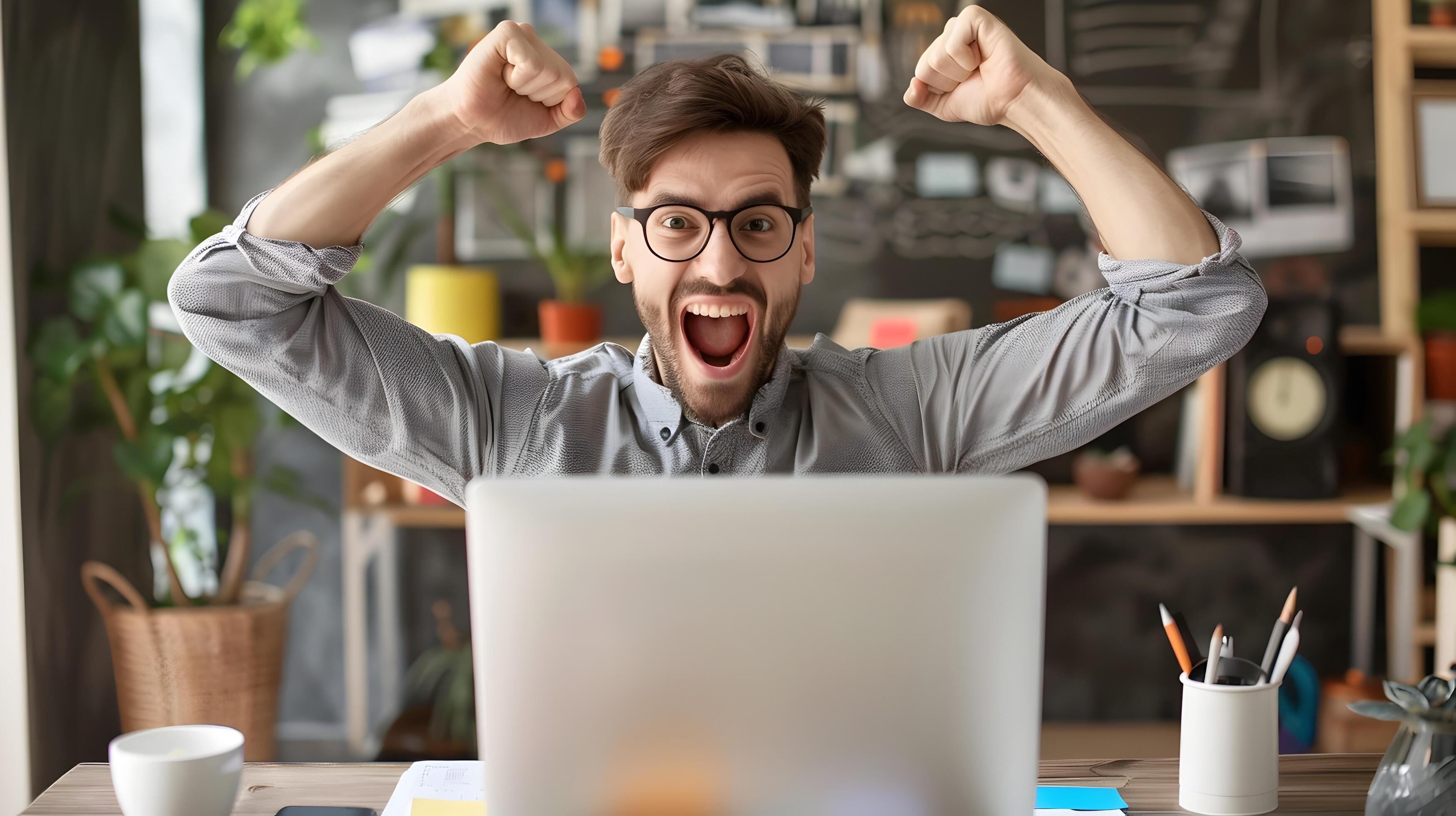 Triumphant Programmer Celebrates Coding Accomplishment in Modern Office ...