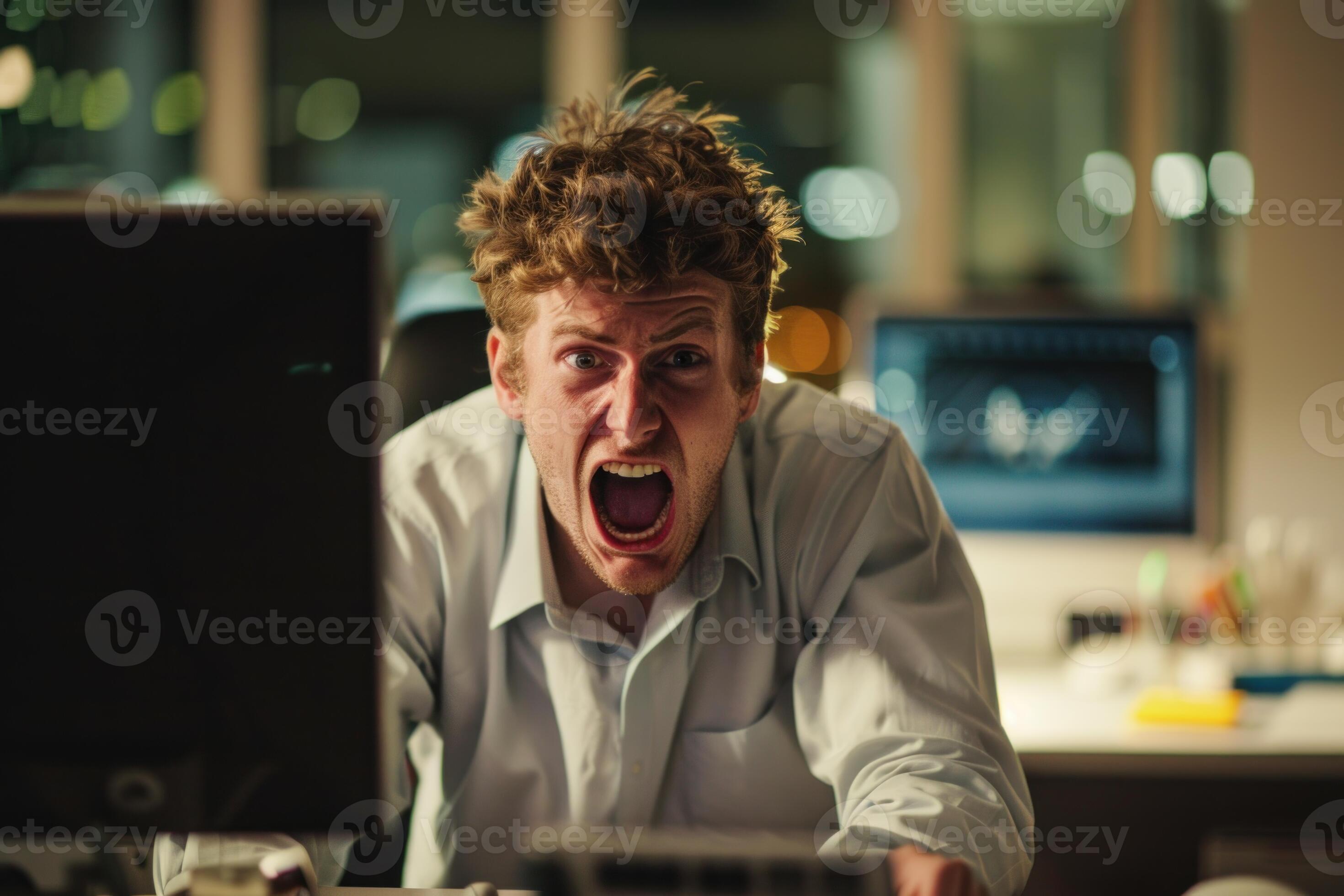 Frustrated office worker yelling at computer screen 47326967 Stock ...