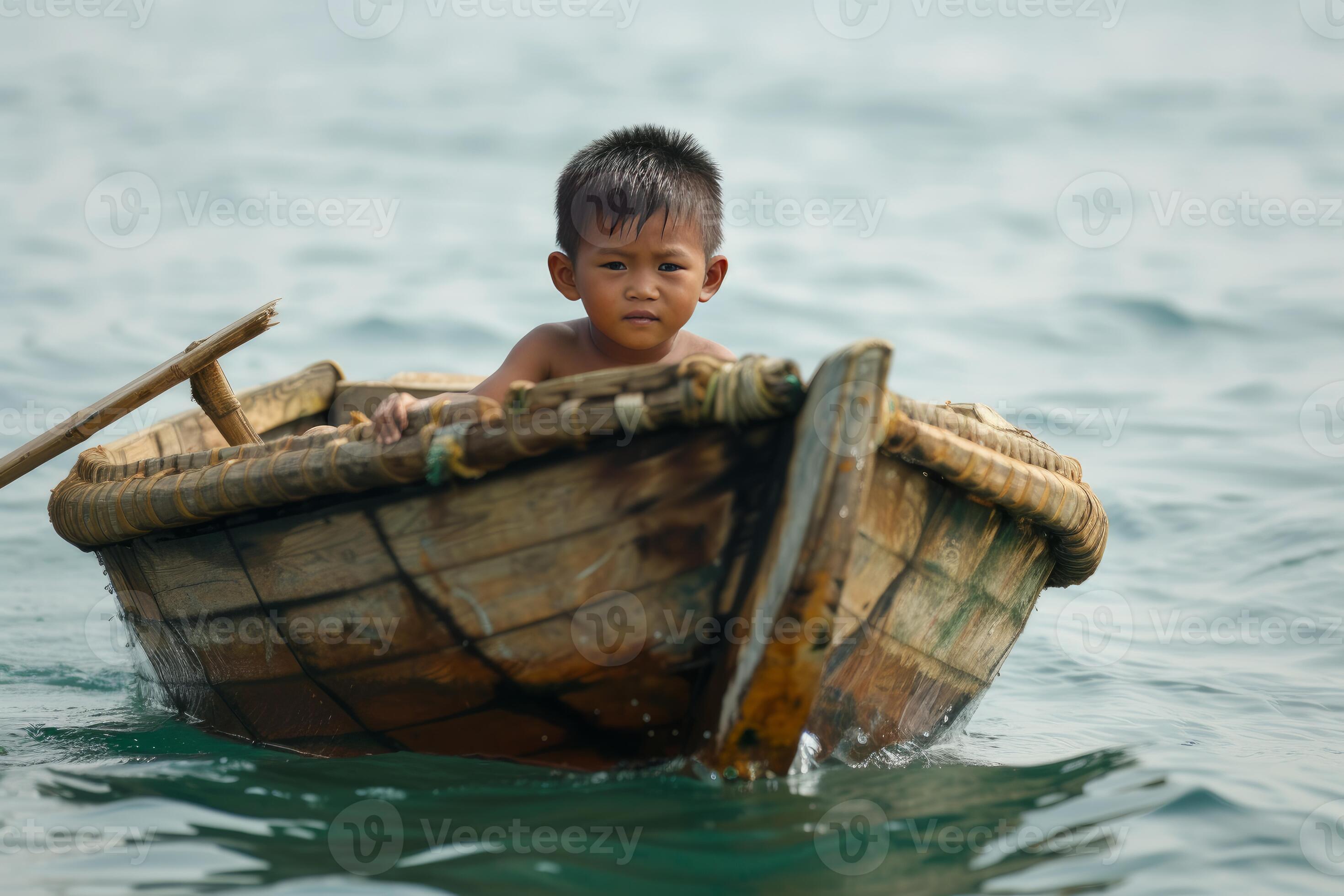 Young child navigating in traditional wooden boat 47332106 Stock Photo ... Young child navigating in traditional wooden boat 47332106 Stock Photo ...