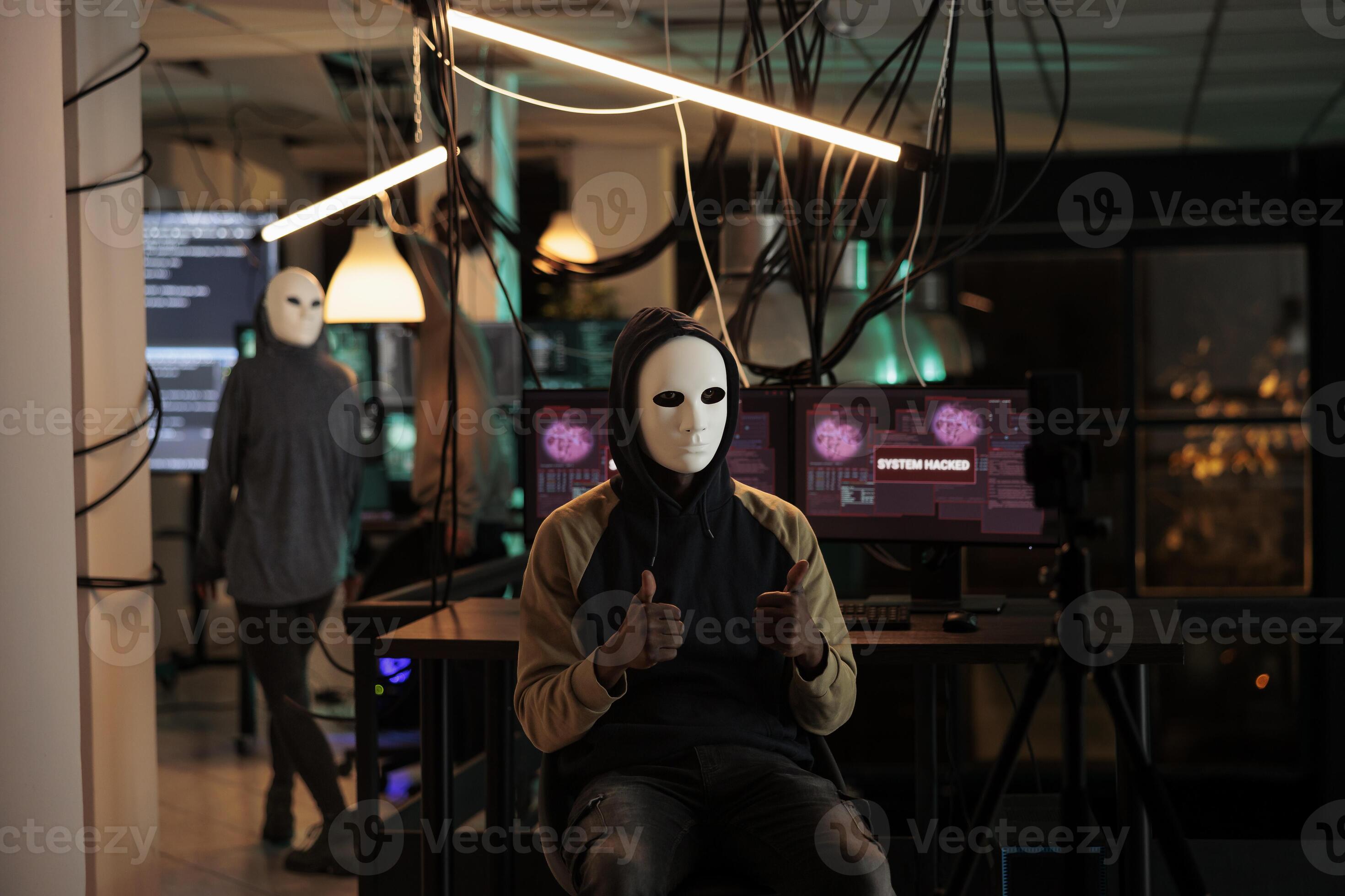 Cybercriminal in mask hacking computer password to steal information ... Cybercriminal in mask hacking computer password to steal information ...