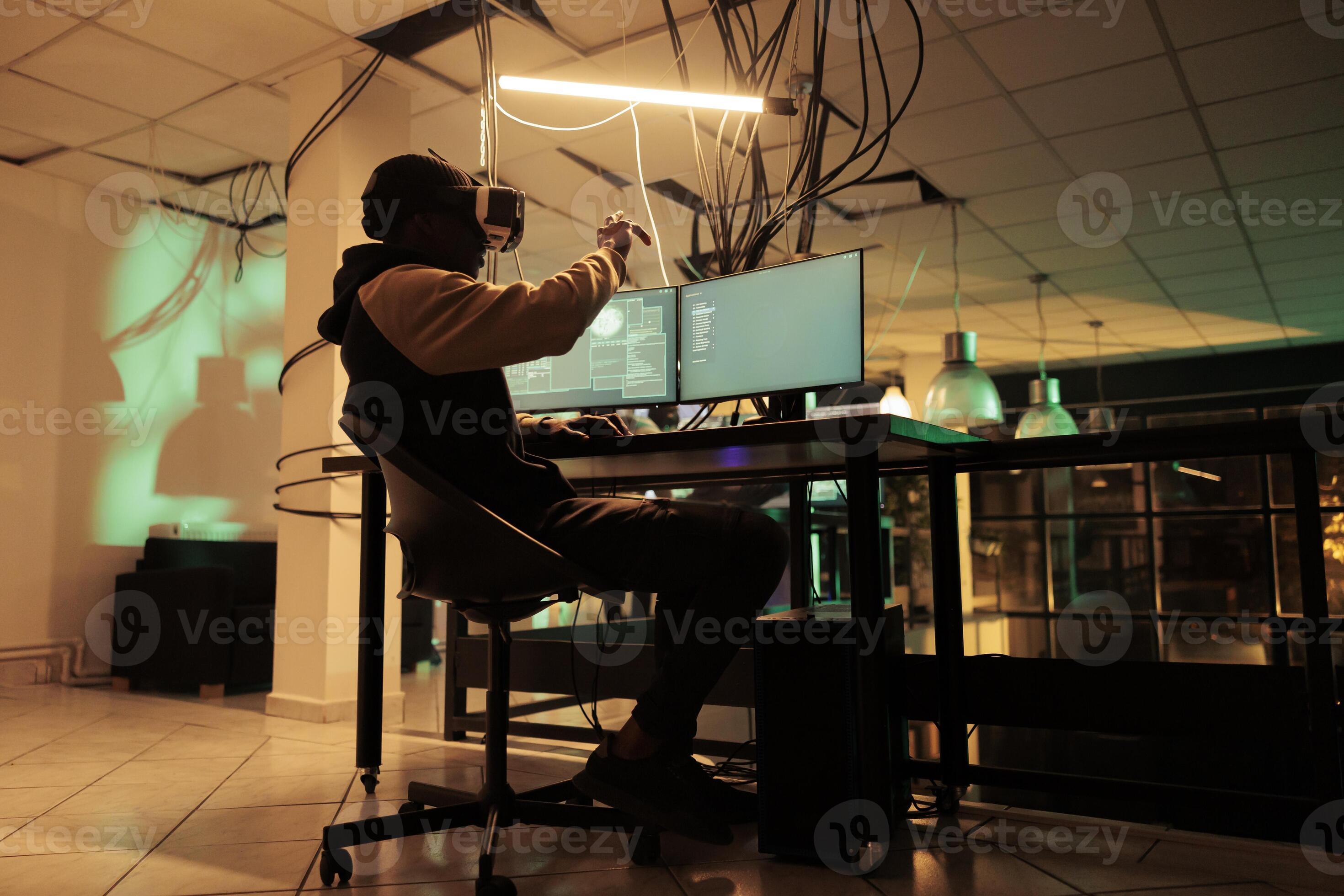 Online criminal using multi monitors and vr glasses to crack encryption and steal passwords. Man ...