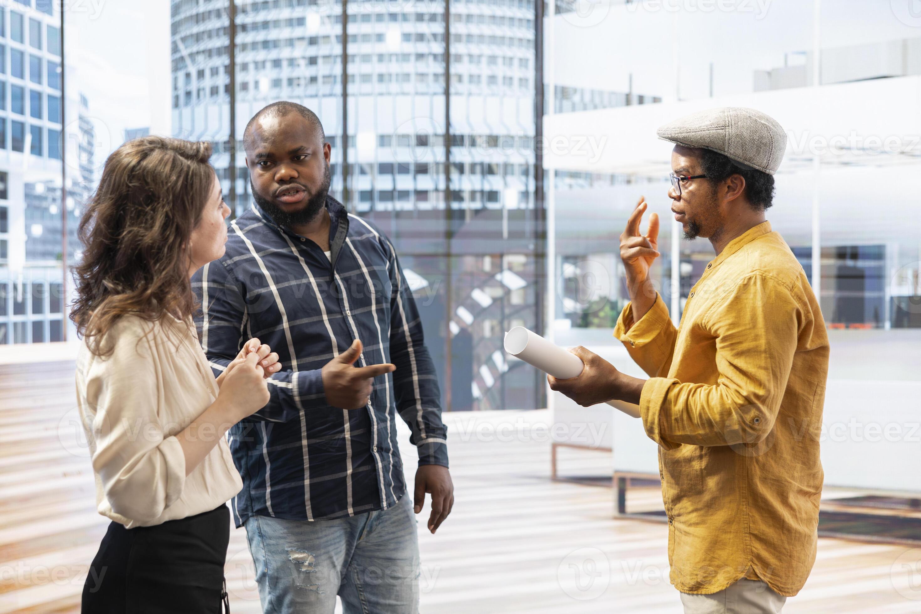 Clients And Real Estate Agent Visiting A Space On An Office Tour