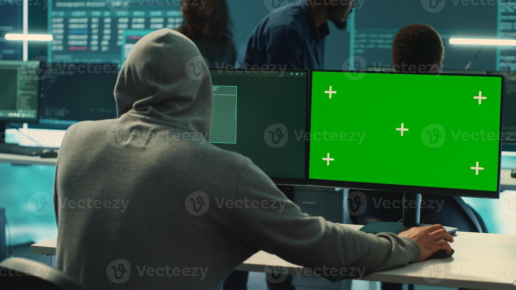 Governmental Hackers Working On Computer With Green Screen To Protect