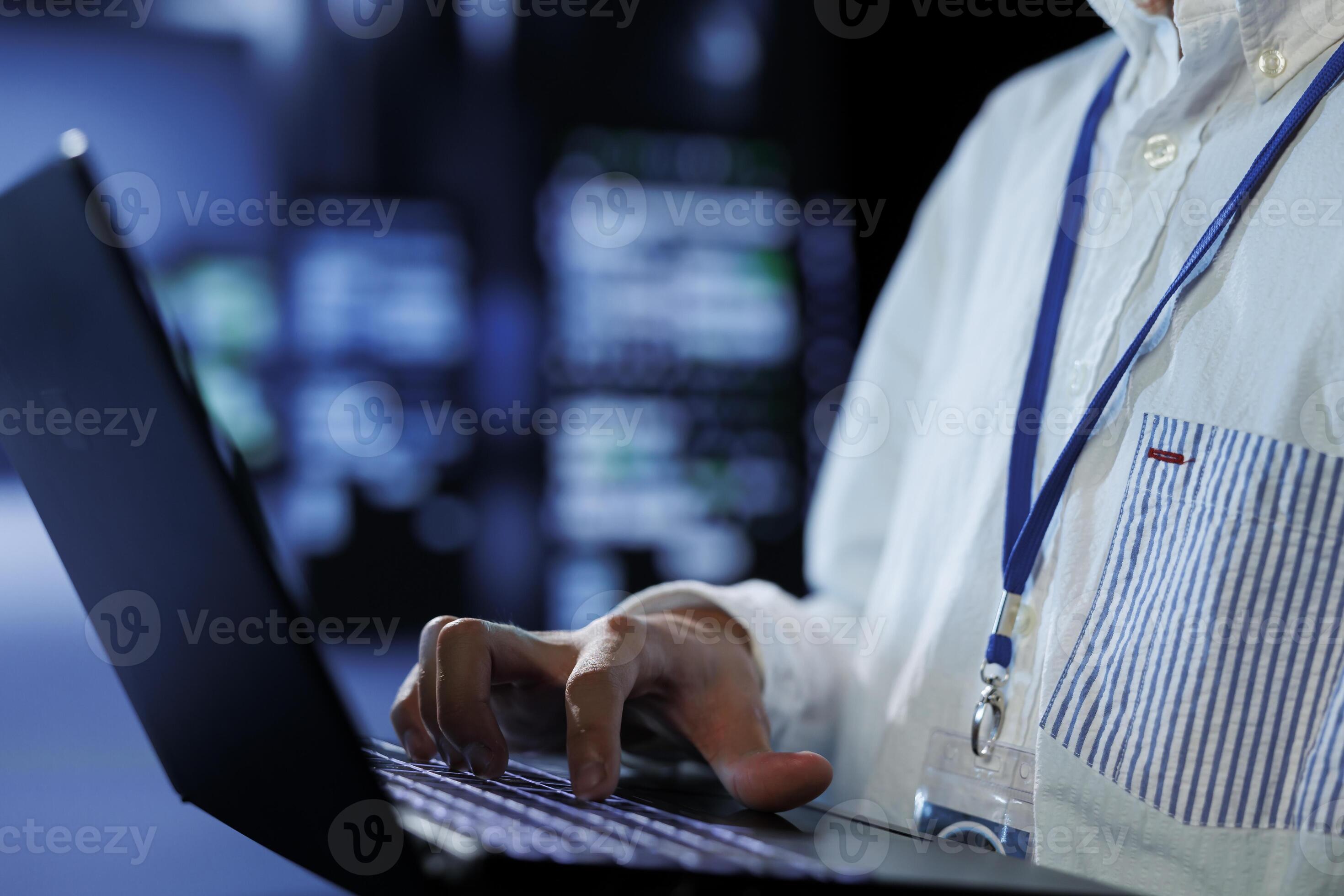 Tech Support In Data Center Uses Laptop To Prevent System Overload During Peak Traffic Periods