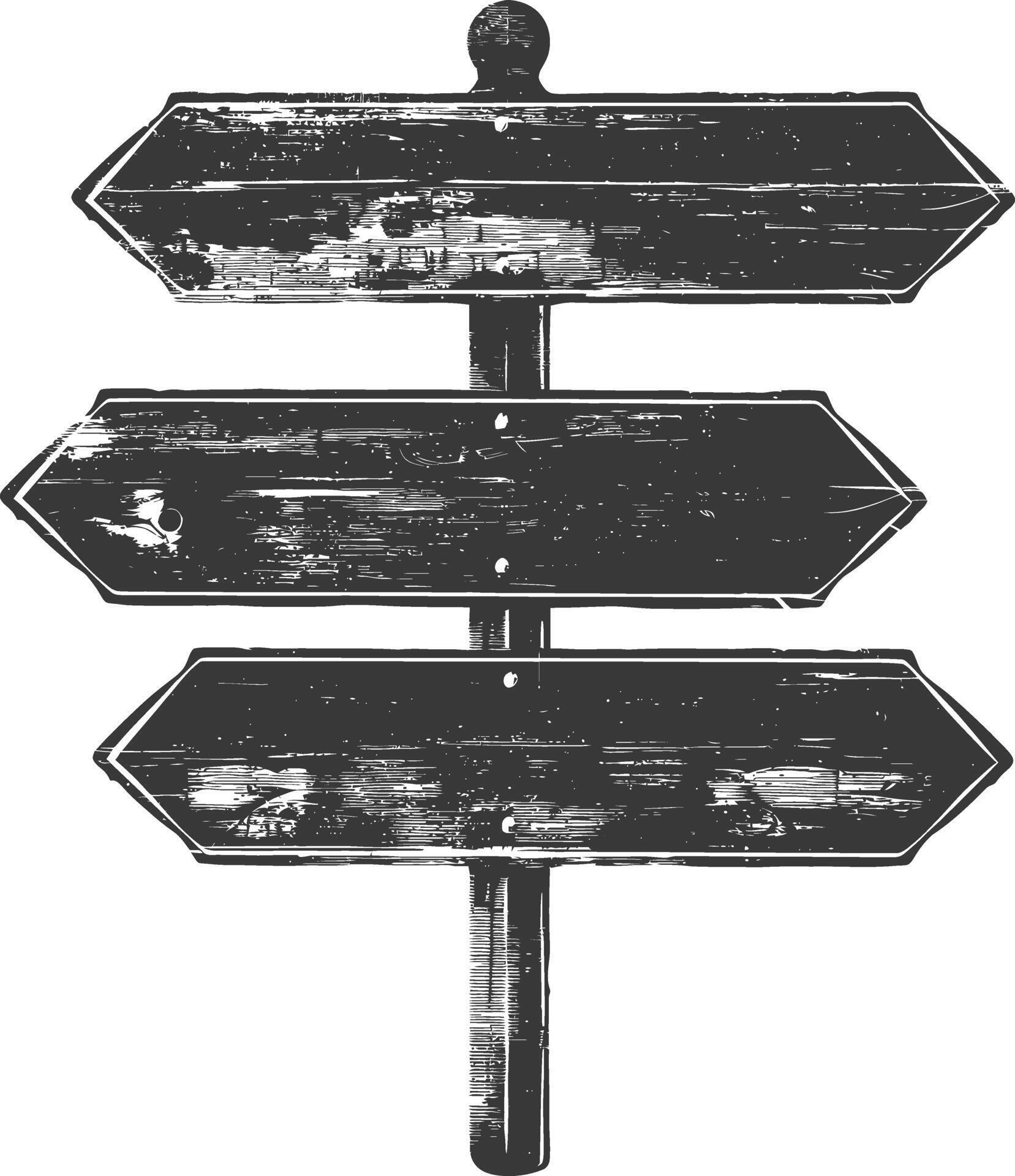 Wooden signpost with three blank arrow signs pointing in different ...