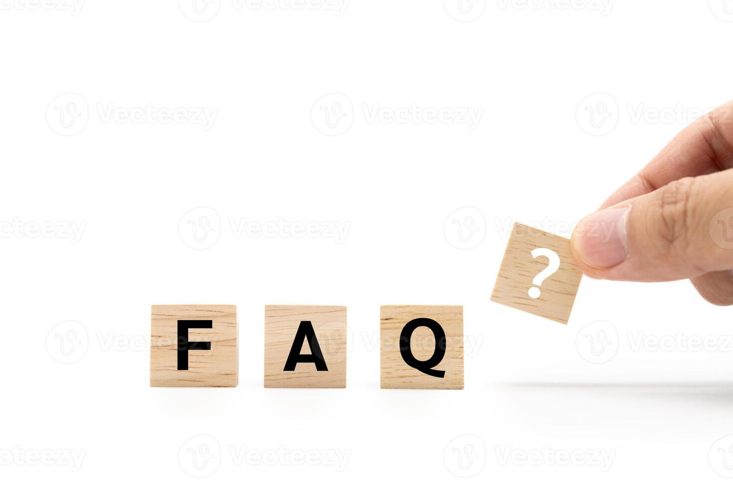 Hand place wooden blocks with FAQ text isolated on white background ... Hand place wooden blocks with FAQ text isolated on white background ...