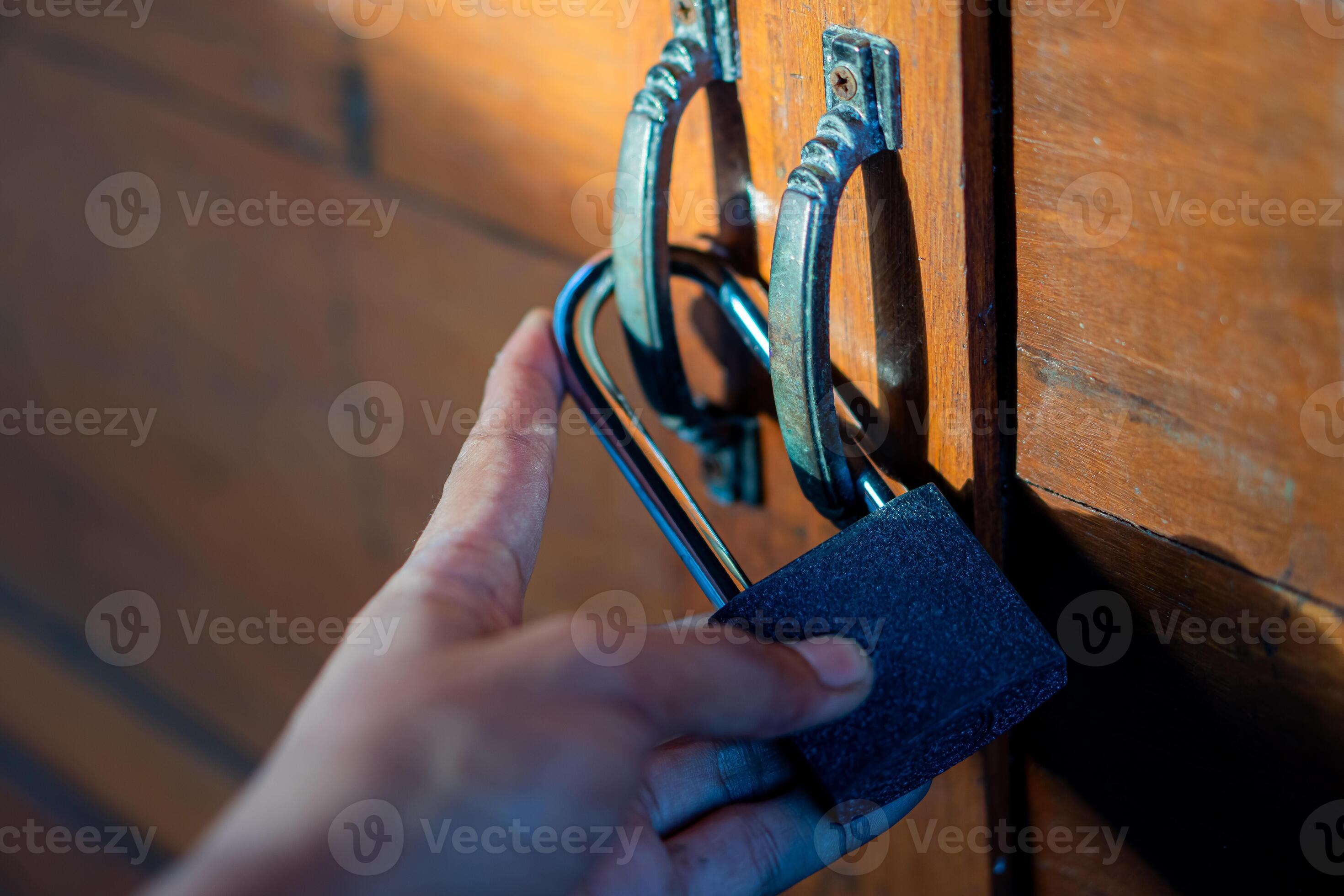 Hand unlocking padlock on wooden door 47581852 Stock Photo at Vecteezy Hand unlocking padlock on wooden door 47581852 Stock Photo at Vecteezy
