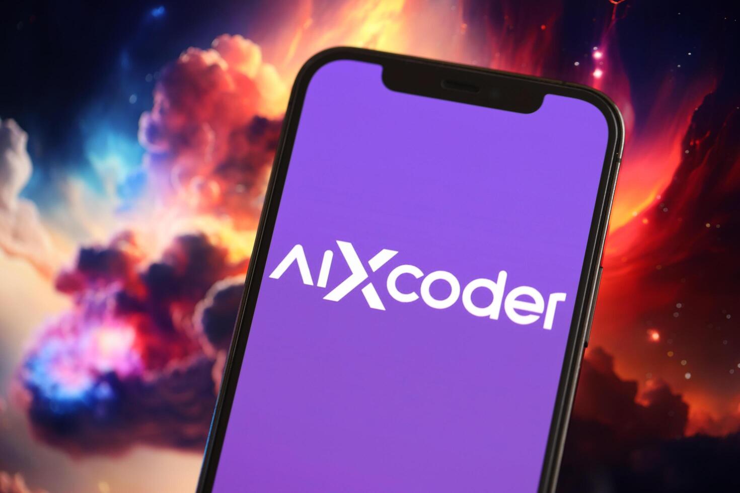 KYIV, UKRAINE - MARCH 17, 2024 AIXcoder logo on iPhone display screen with background of ...