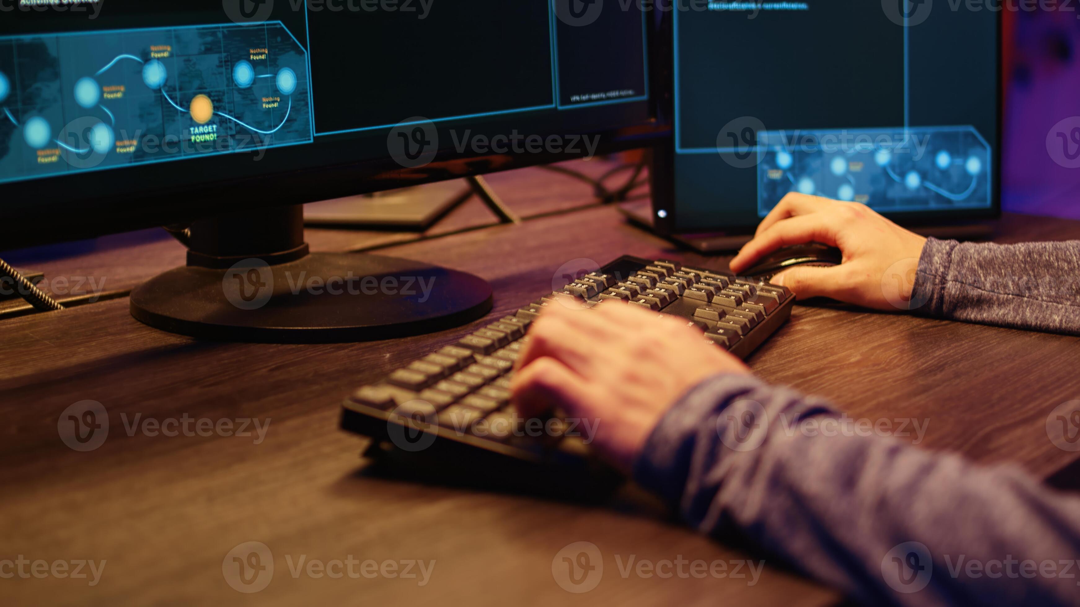 Hacker In Secret Underground Shelter Typing On Keyboard Writing Lines Of Code On Computer