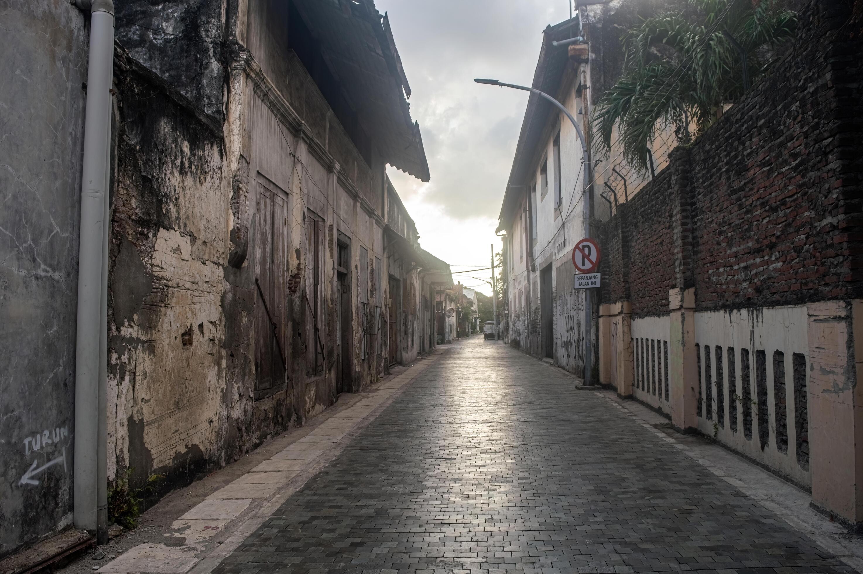 Small vintage alley with historical or heritage buildings in the old city of Surabaya, Indonesia ...