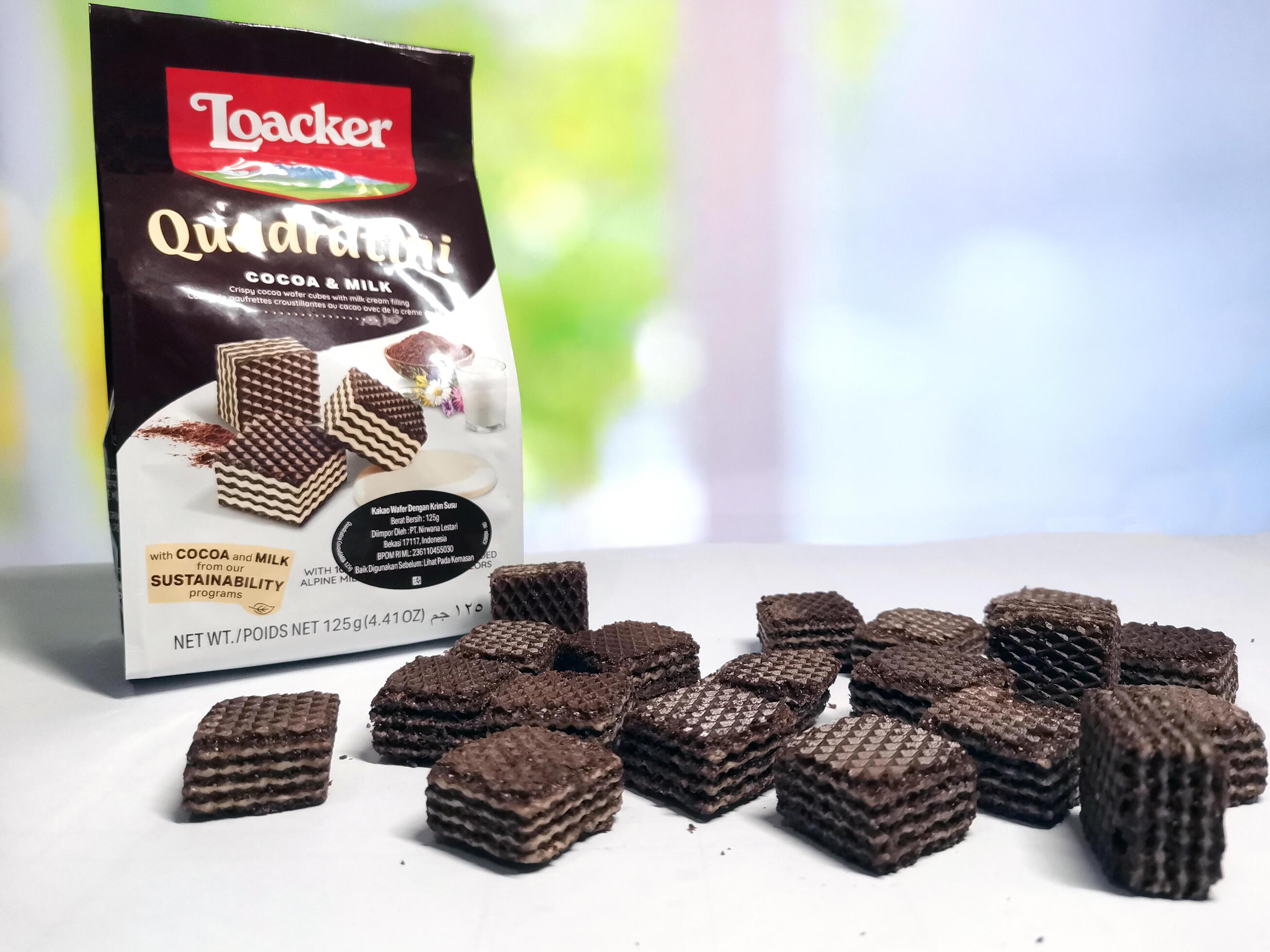 Jakarta, Indonesia - July 3, 2024 LOACKER Quadratini Wafer. Crispy chocolate cube wafers with ...