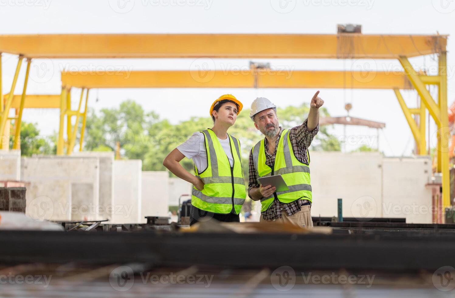 Engineer And Foreman In Hardhats Discussing On Construction Site Engineer And Worker Team With