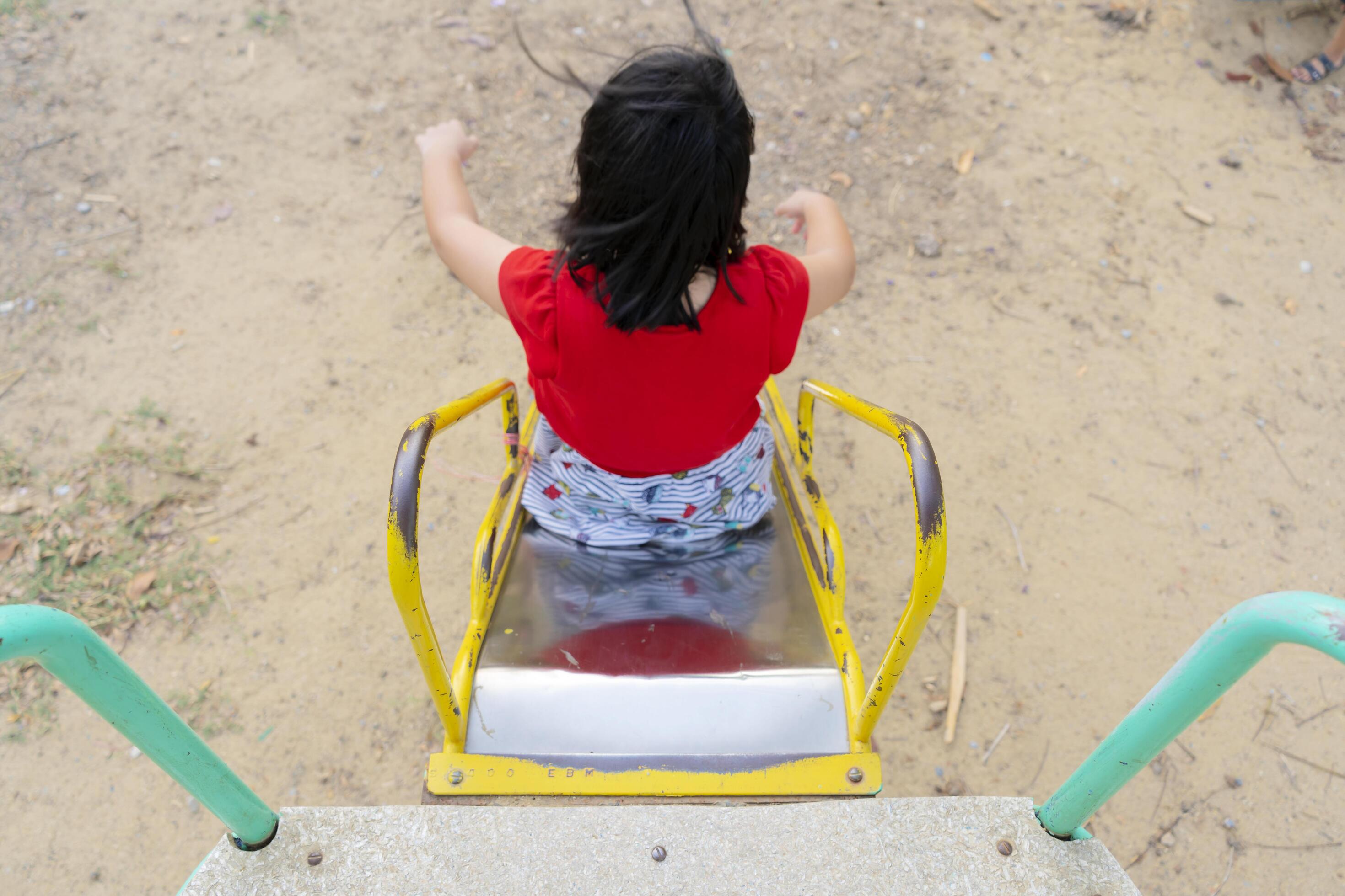 Asian girl playing wooden slider and happy fun or cheerful enjoy During the lunch break at ...