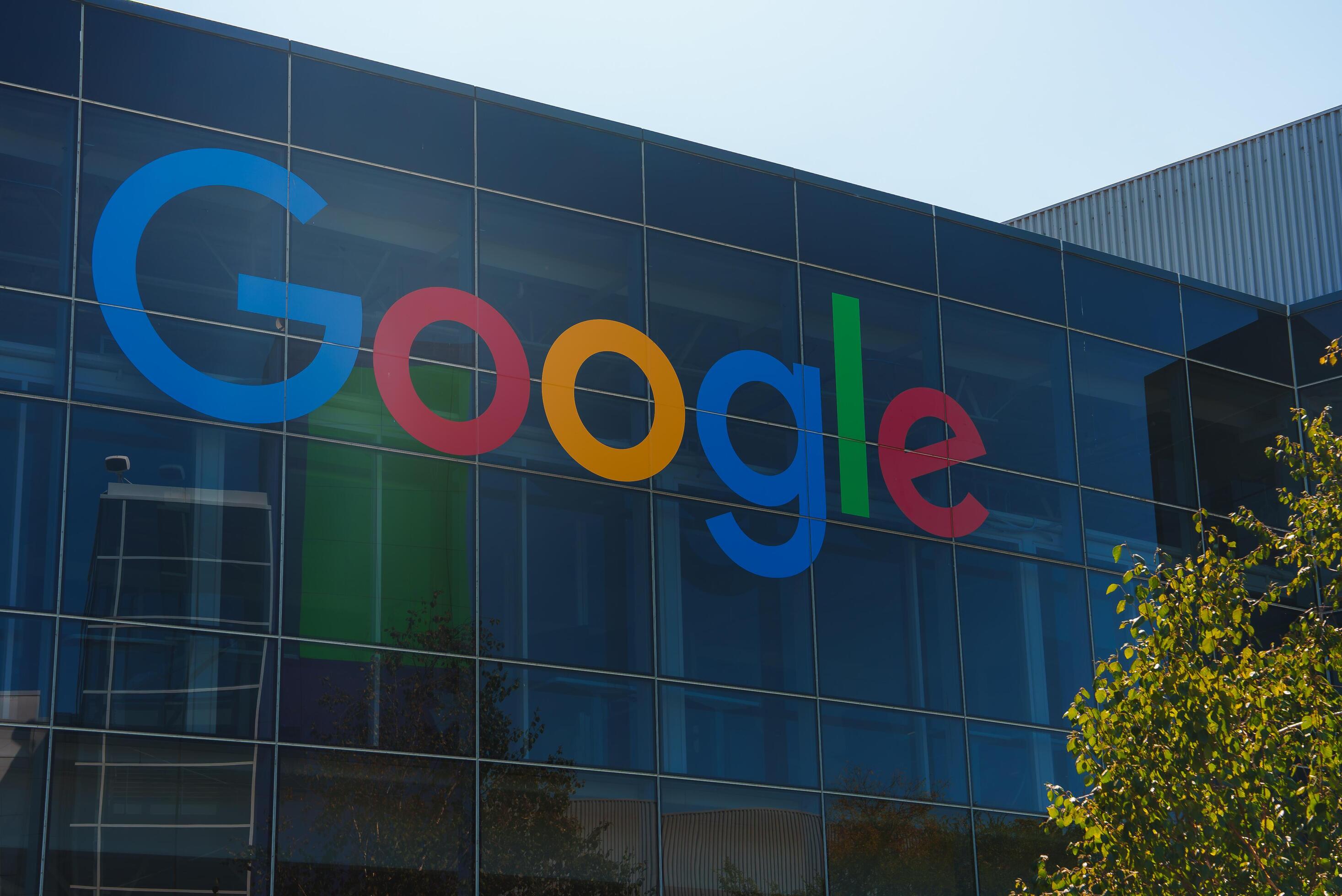 Modern building with vivid glass facade showcasing colorful Google logo ... Modern building with vivid glass facade showcasing colorful Google logo ...