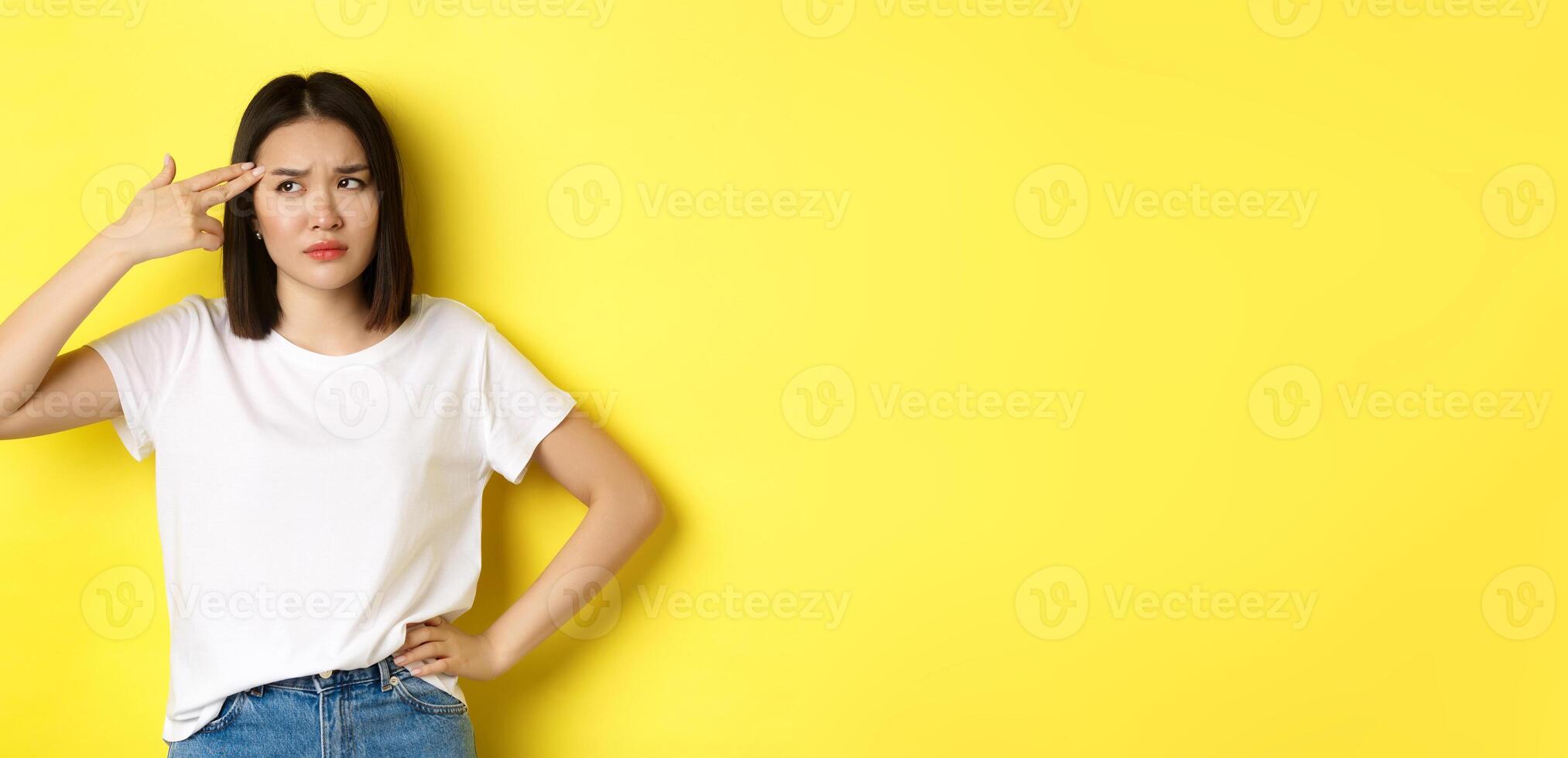 Woman showing kill me please gesture, shooting herself in head with ...