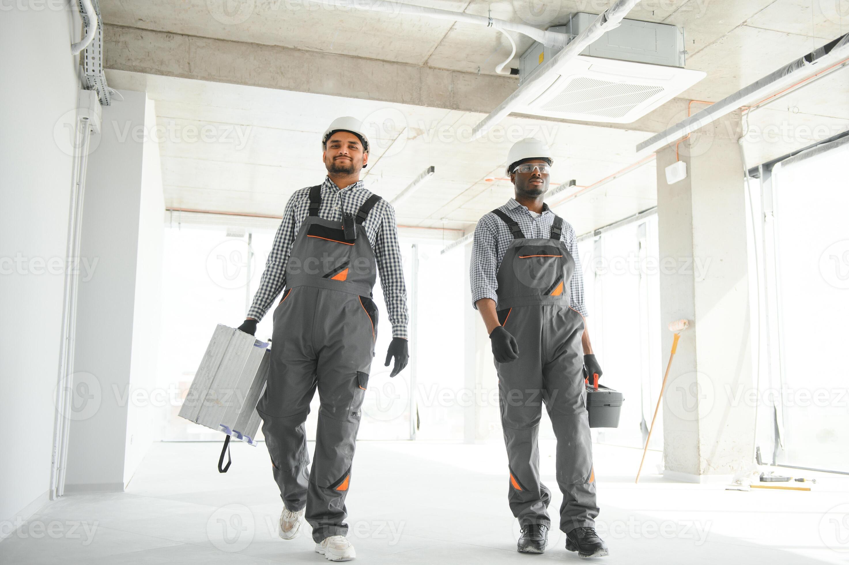 multicultural builders in hardhats at construction site 47967469 Stock Photo at Vecteezy