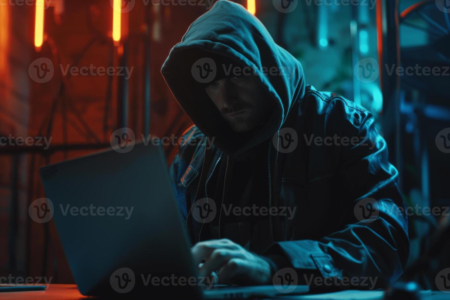 Hacker In Hood Hacking At Computer In Dark Room Computer Criminal Uses Malware To Hack Devices