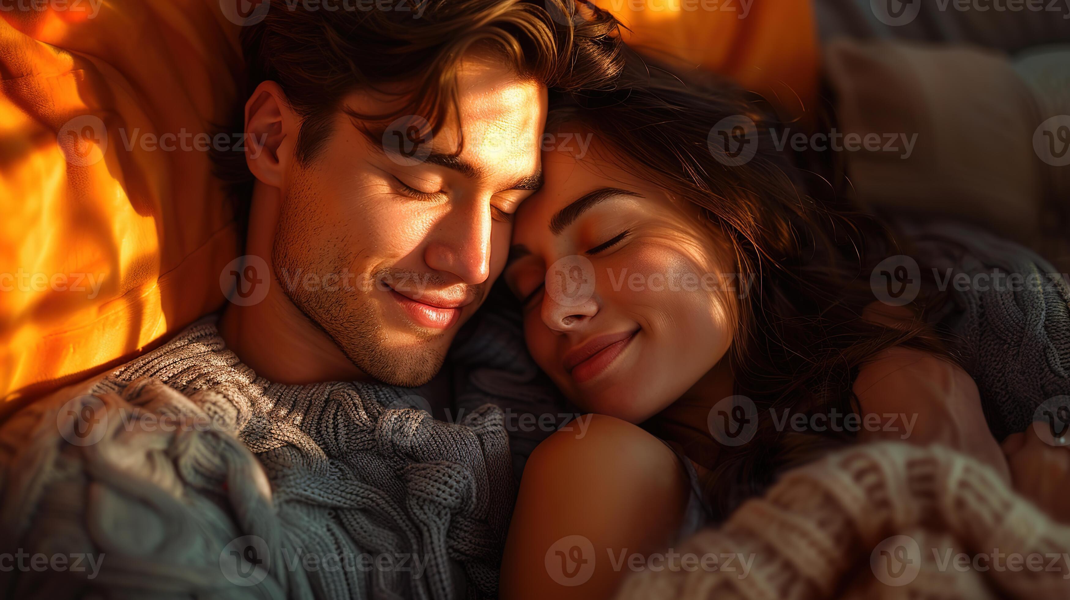 A warm, cozy setting featuring a happy couple enjoying a series of cuddle positions, surrounded ...