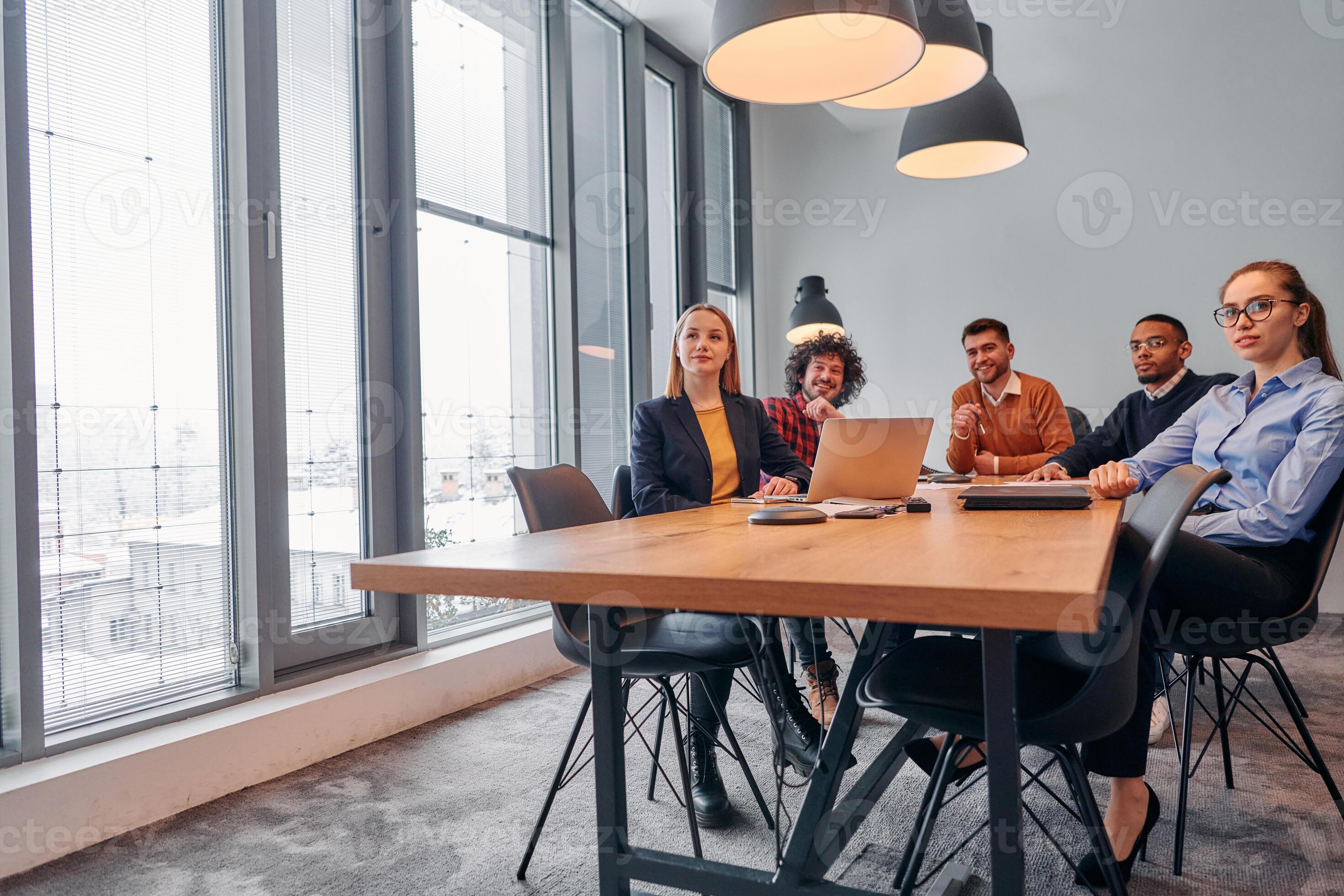 Dynamic Entrepreneurial Team Strategizing Projects In Modern Office