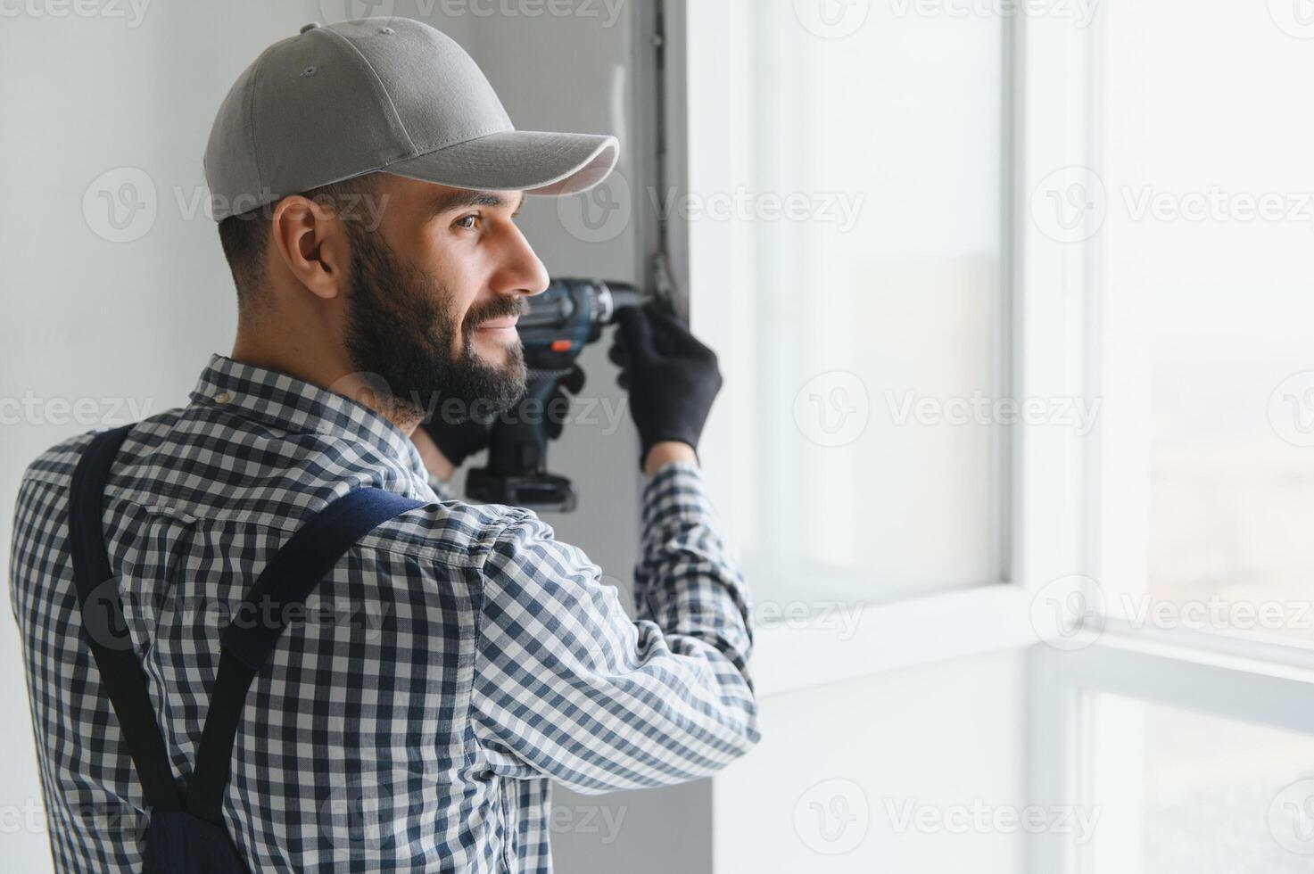 service man installing window with screwdriver 48226587 Stock Photo at ... service man installing window with screwdriver 48226587 Stock Photo at ...