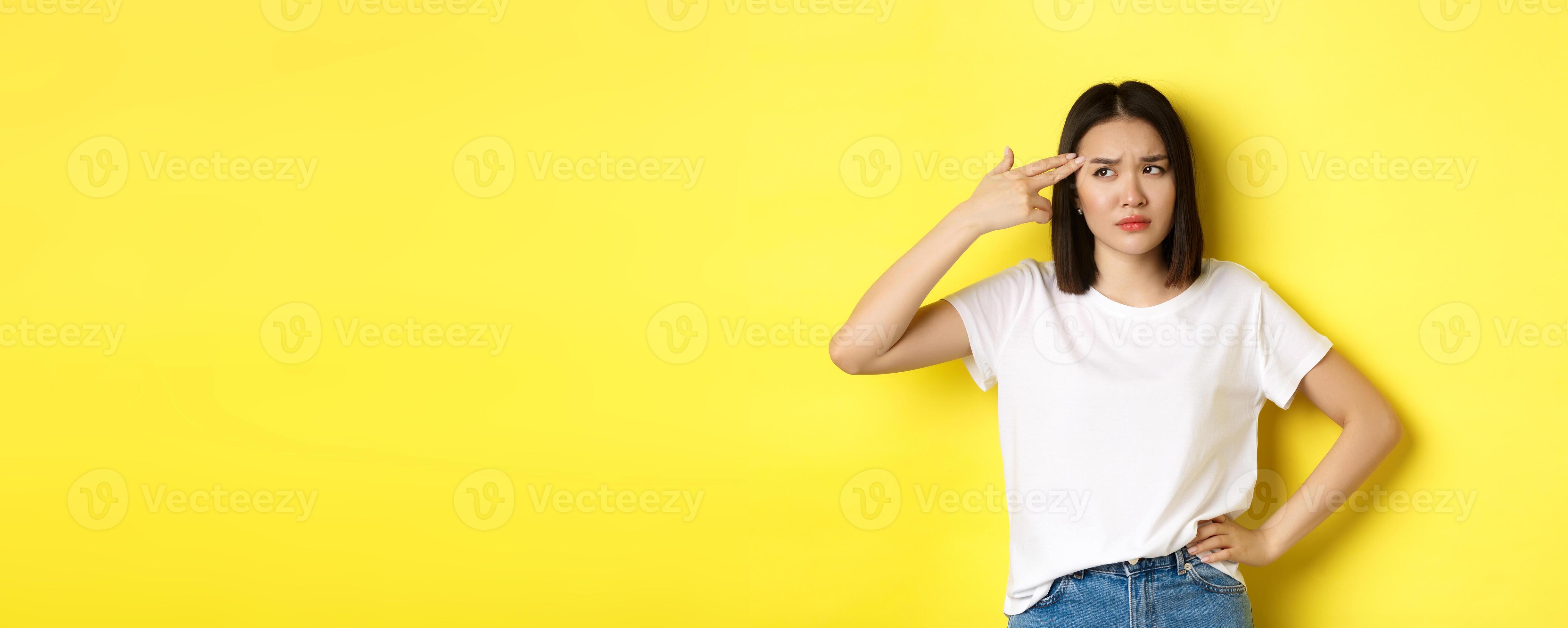Woman showing kill me please gesture, shooting herself in head with ...