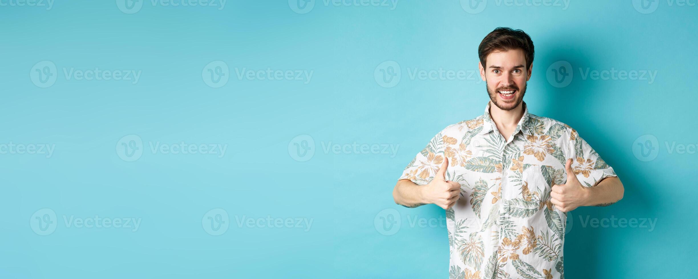 Handsome tourist showing thumbs up and say yes, praising good tourism ... Handsome tourist showing thumbs up and say yes, praising good tourism ...