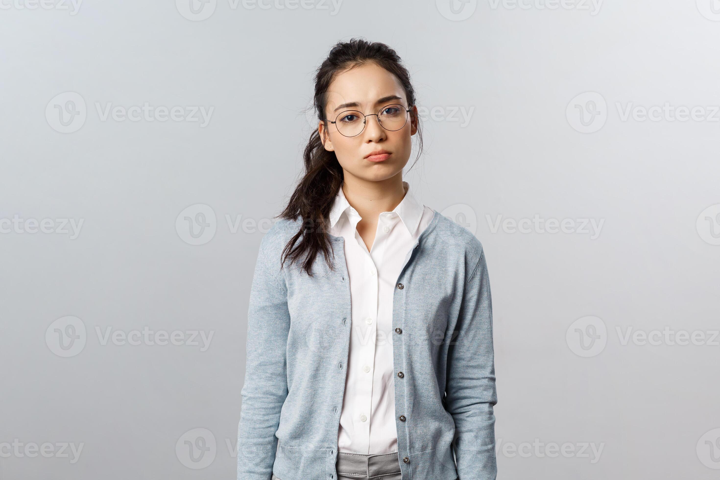 Gloomy and indifferent, lonely asian woman in glasses, feel uneasy and ...