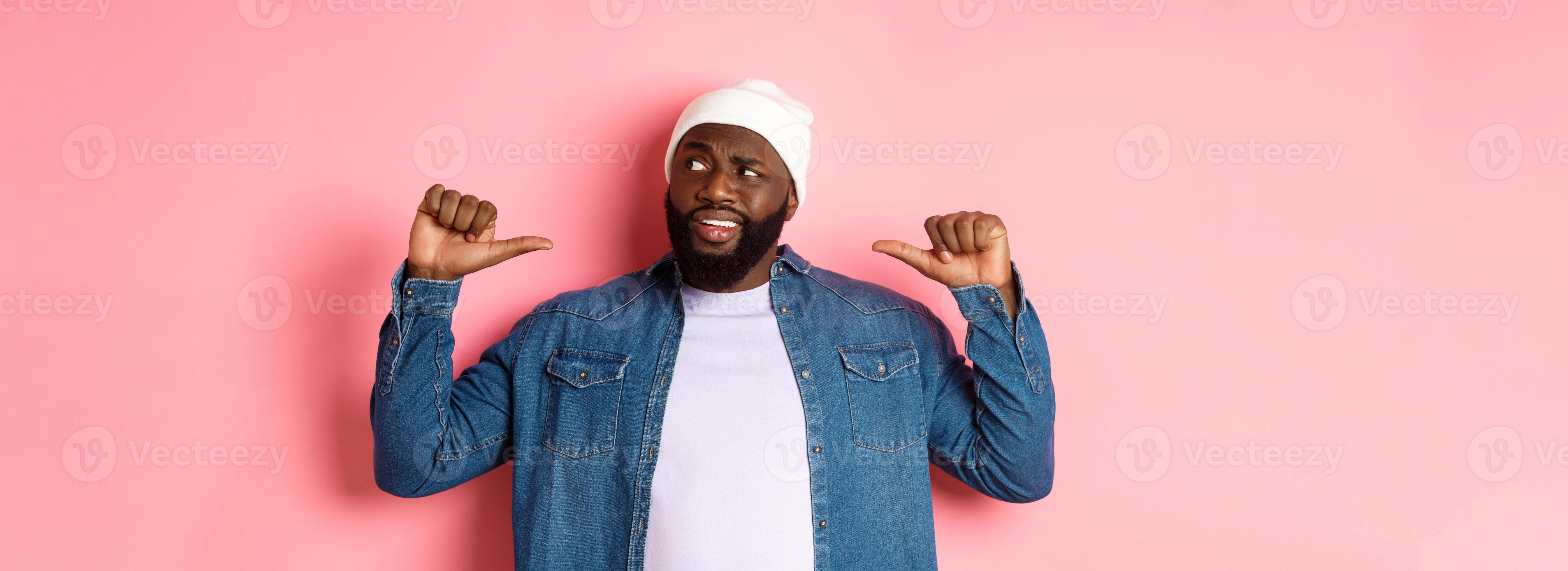 Confused Black Man Staring Right And Pointing At Himself Unsure Having