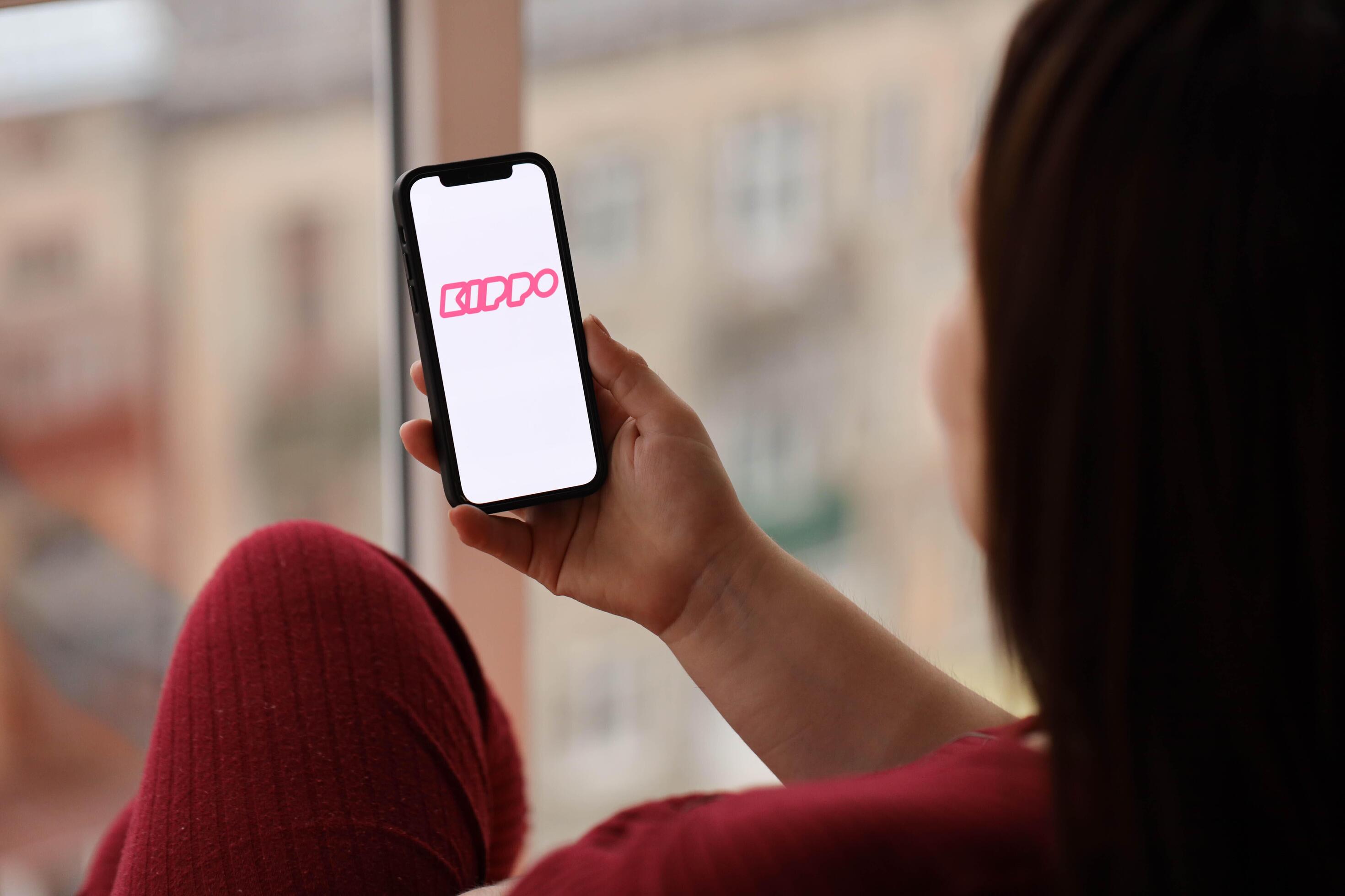 KYIV, UKRAINE - FEBRUARY 23, 2024 Kippo logo of famous dating website or app on iPhone display ...