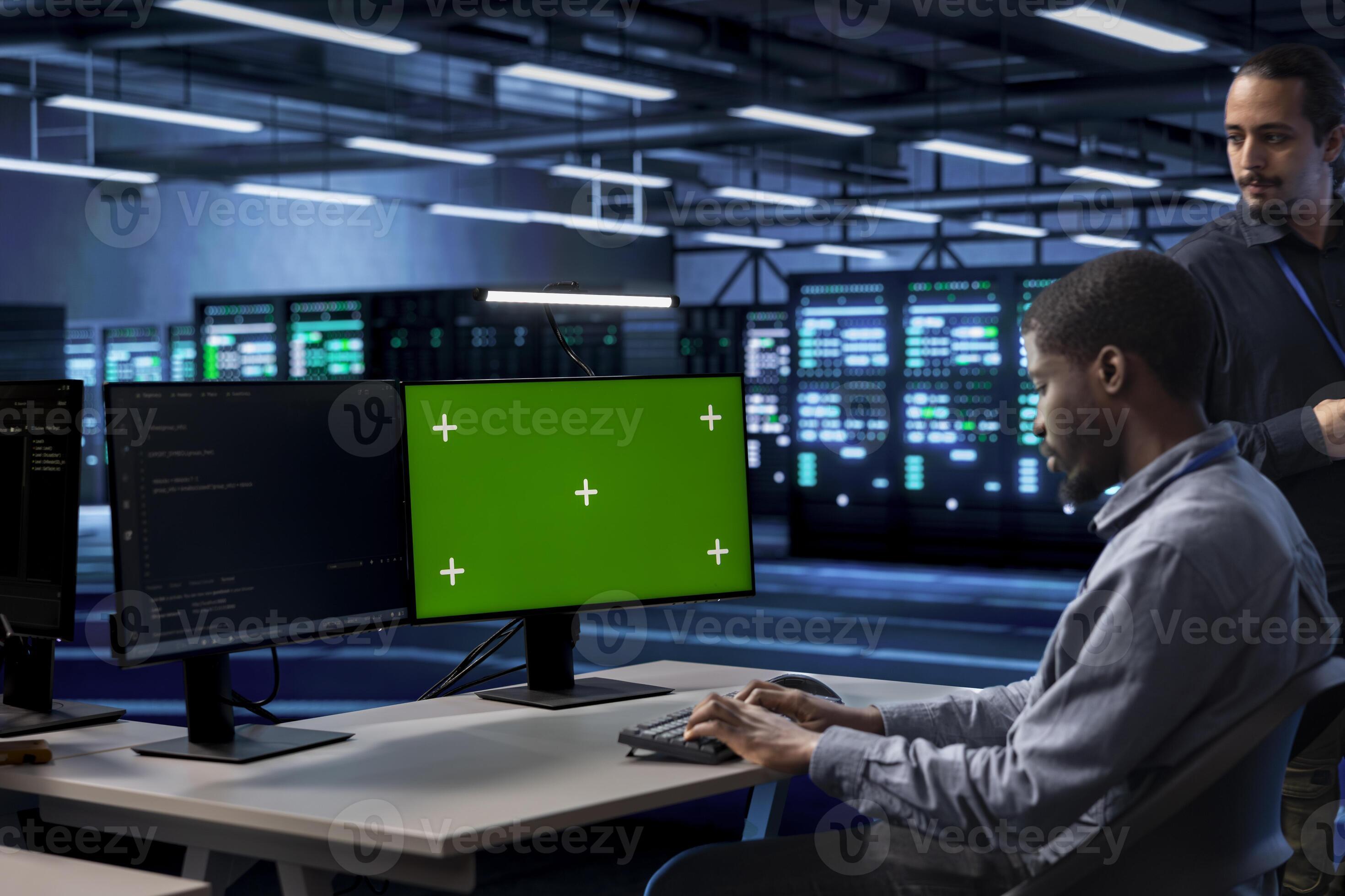 Engineer In Server Hub Using Green Screen Computer To Find Firewall Misconfigurations Affecting
