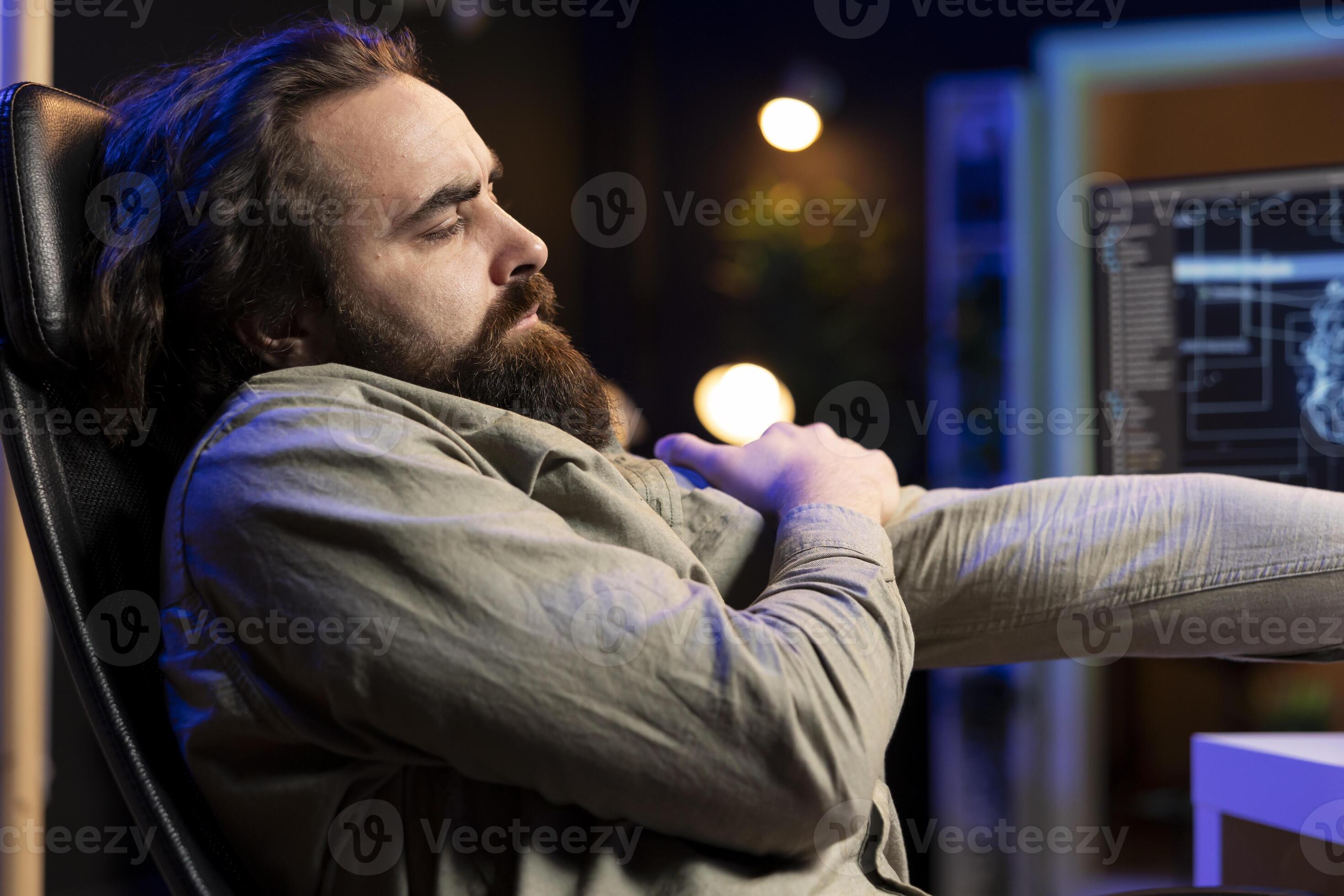 Computer scientist stretching and taking break after programming sentient artificial ...
